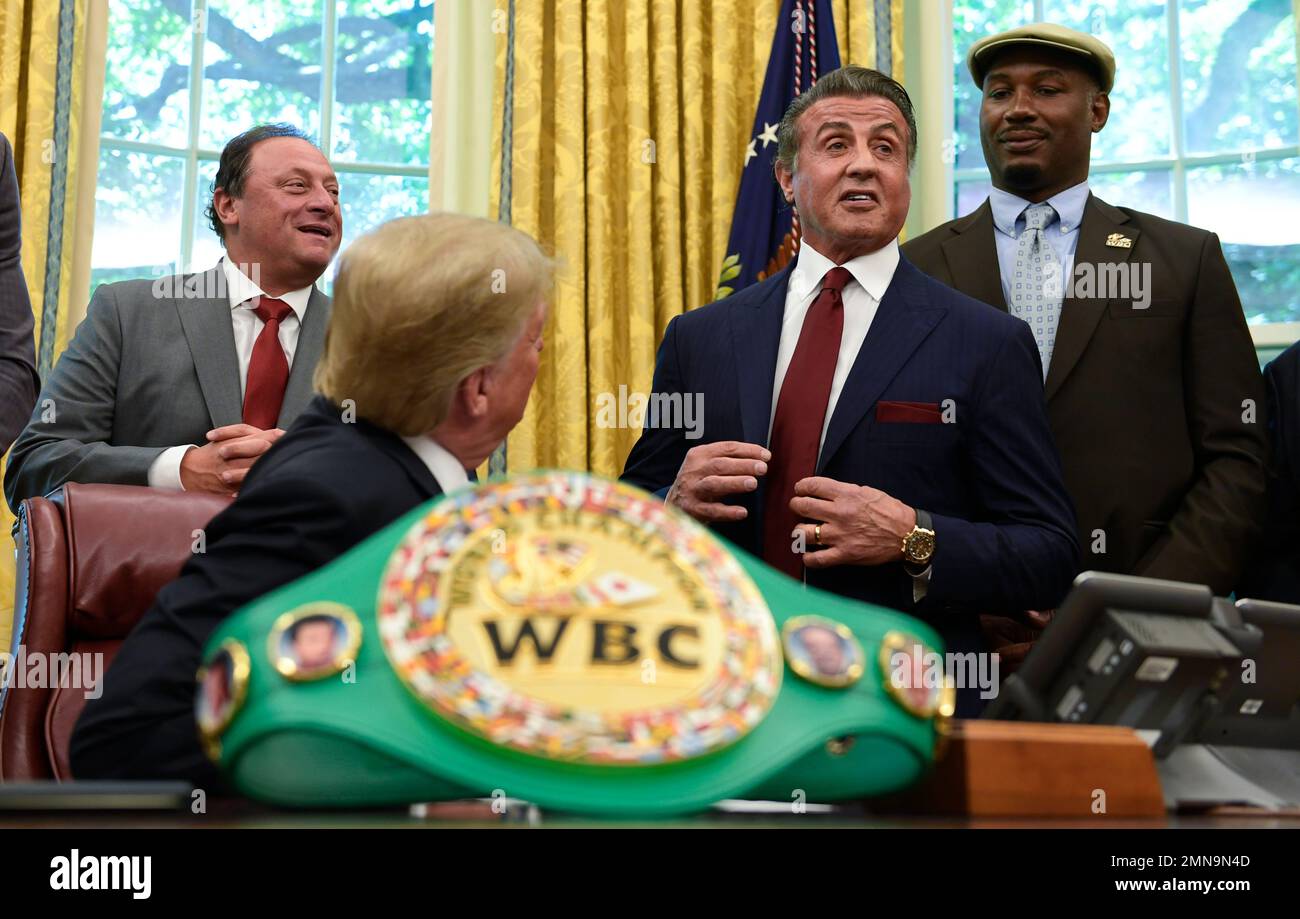 President Donald Trump, second from left, listens as Sylvester Stallone ...