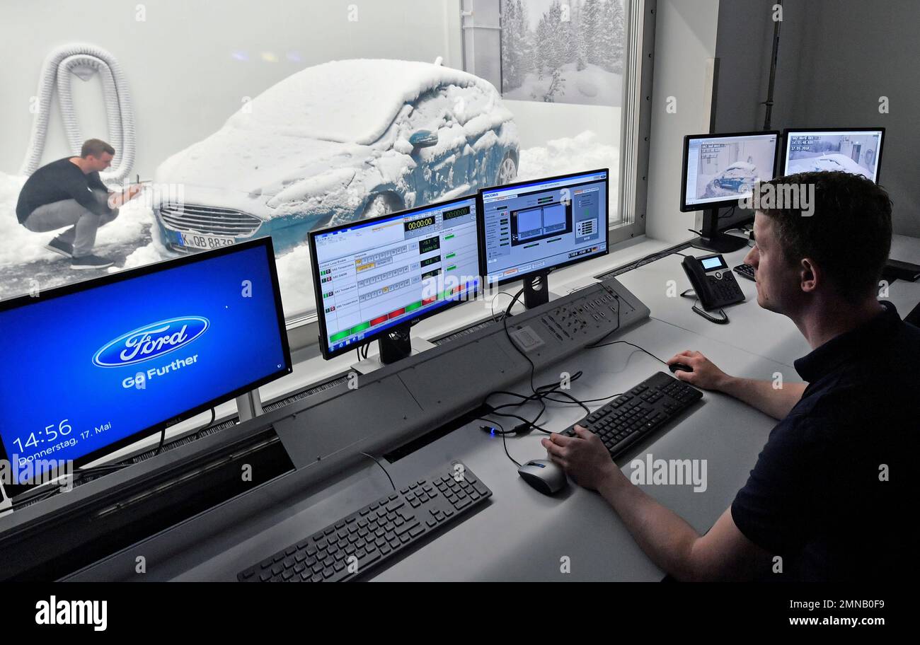 An engineer controls a car in a cold testing room at the brand new Ford ...