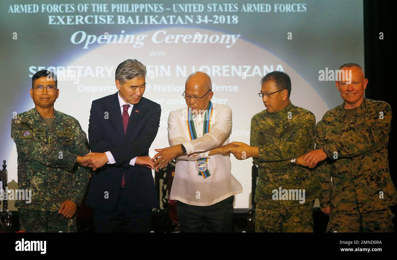 Philippine Defense Secretary Delfin Lorenzana, center, U.S. Ambassador ...