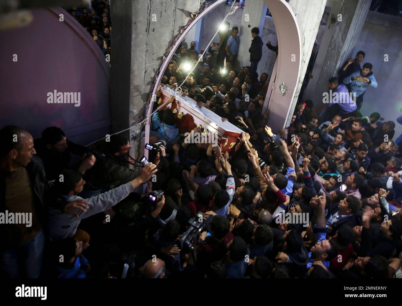 Mourners carry the coffin of Palestinian scientist Fadi al-Batsh, after ...