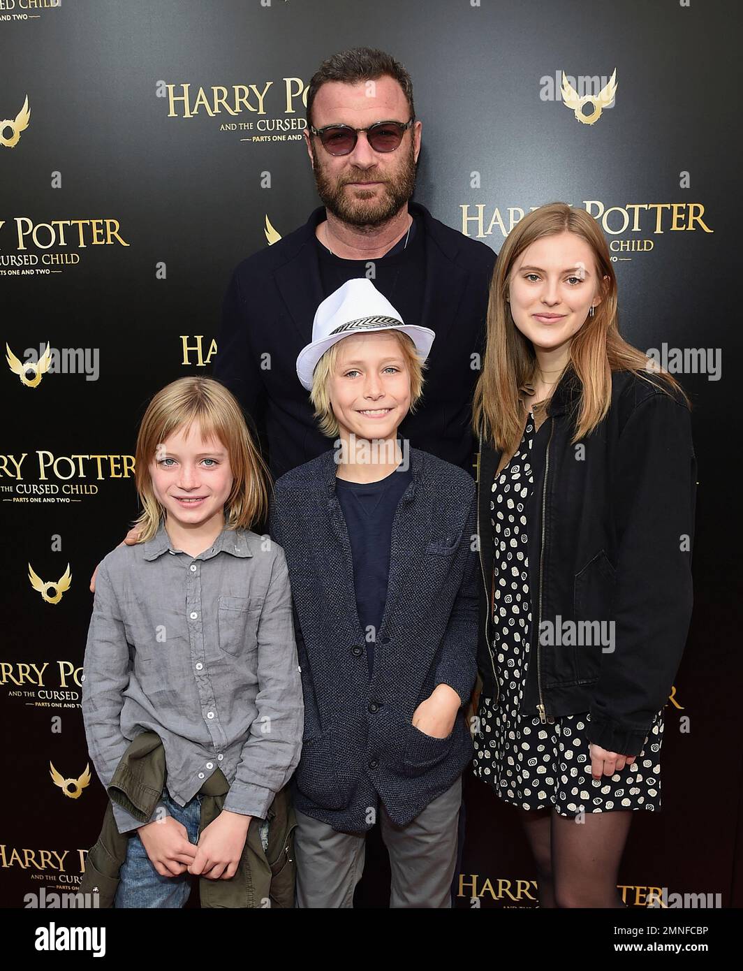 Actor Liev Schreiber poses with his girlfriend Taylor Neisen and his ...