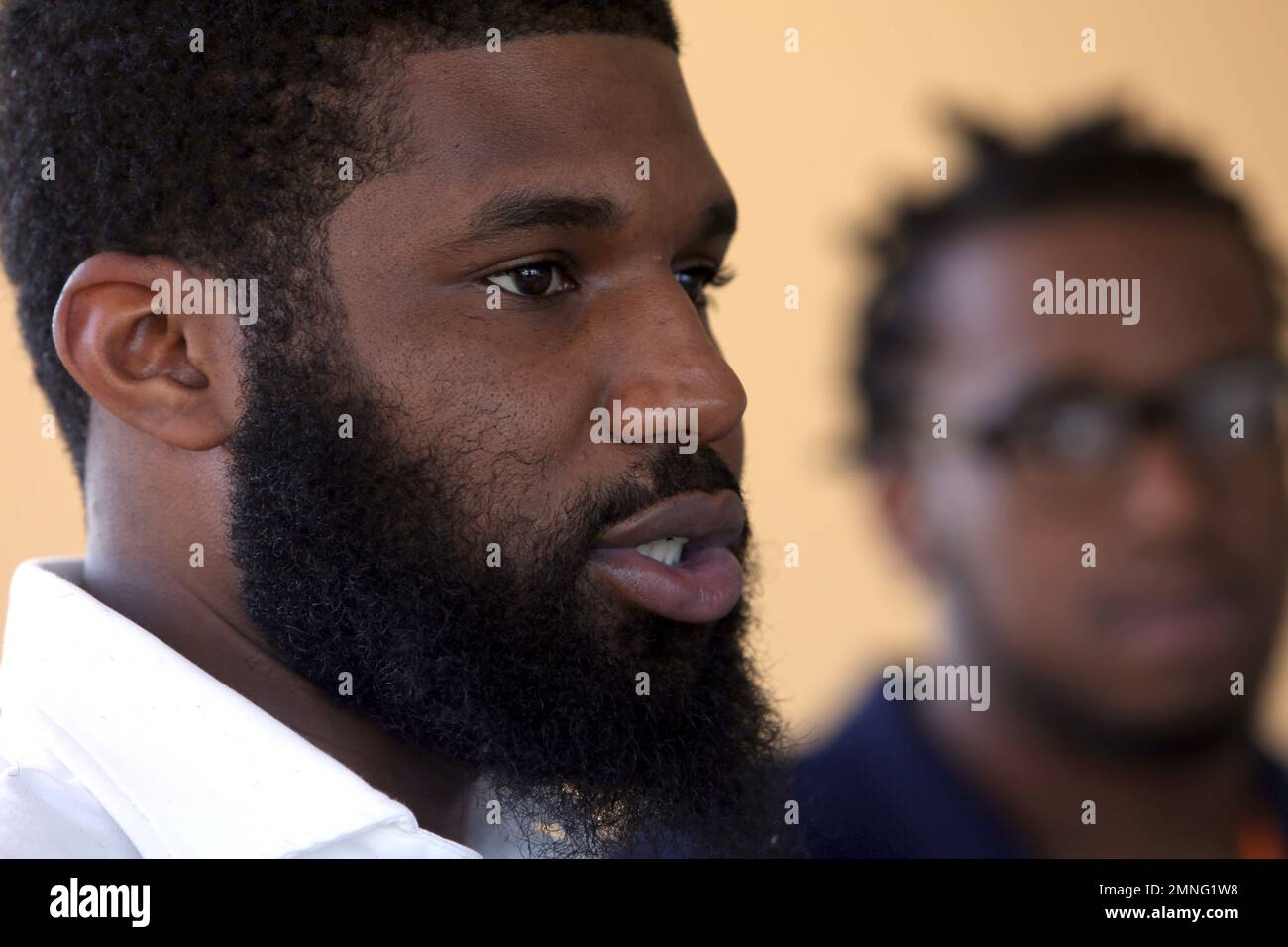 Rashon Nelson, left, speaks as Donte Robinson, right, looks on during an interview with the ...