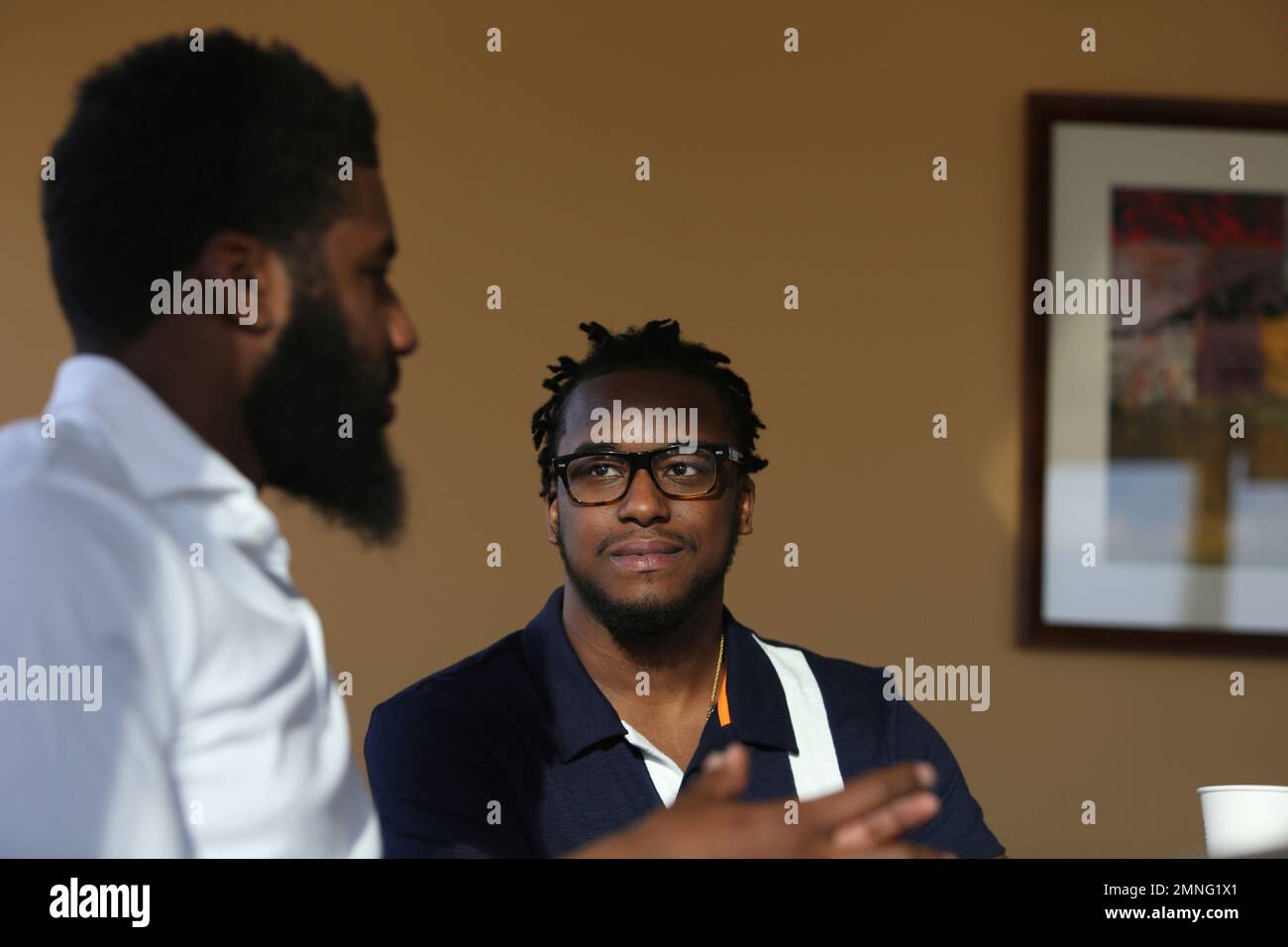 Rashon Nelson, left, speaks as Donte Robinson looks on during an interview with the Associated ...
