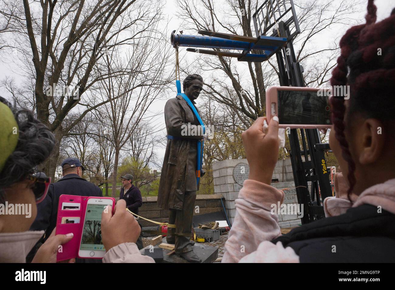 The statue of Dr. J. Marion Sims, is removed by crane, Tuesday, April ...
