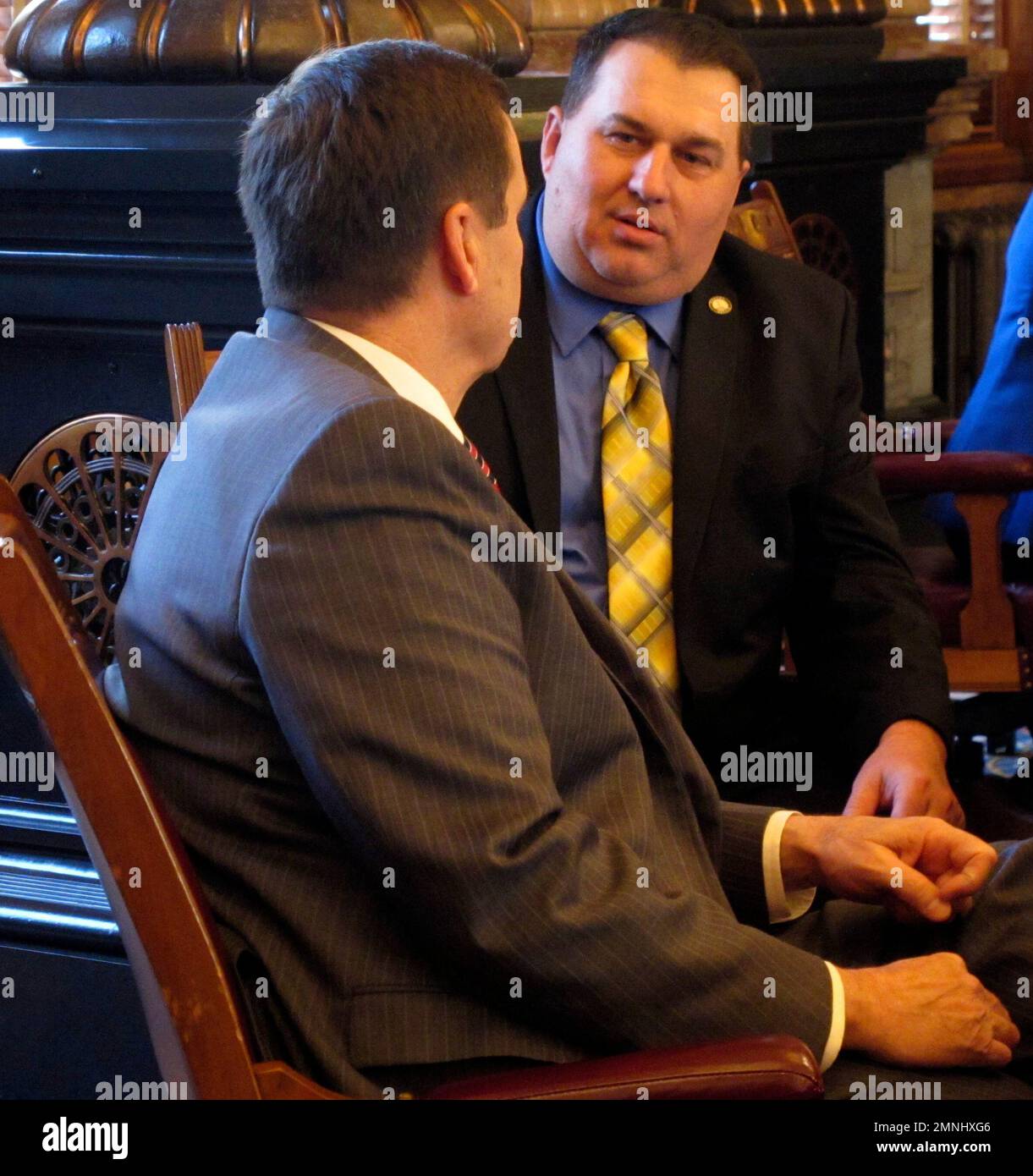 Kansas state Sen. Rob Olson, R-Olathe, right, confers with Sen. Dennis ...