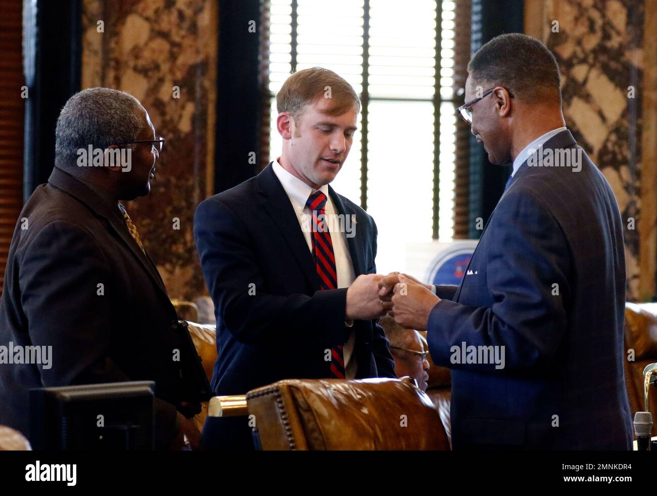 Sen. Neil Whaley, R-Potts Camp, center, fist bumps with Sen. Sollie ...