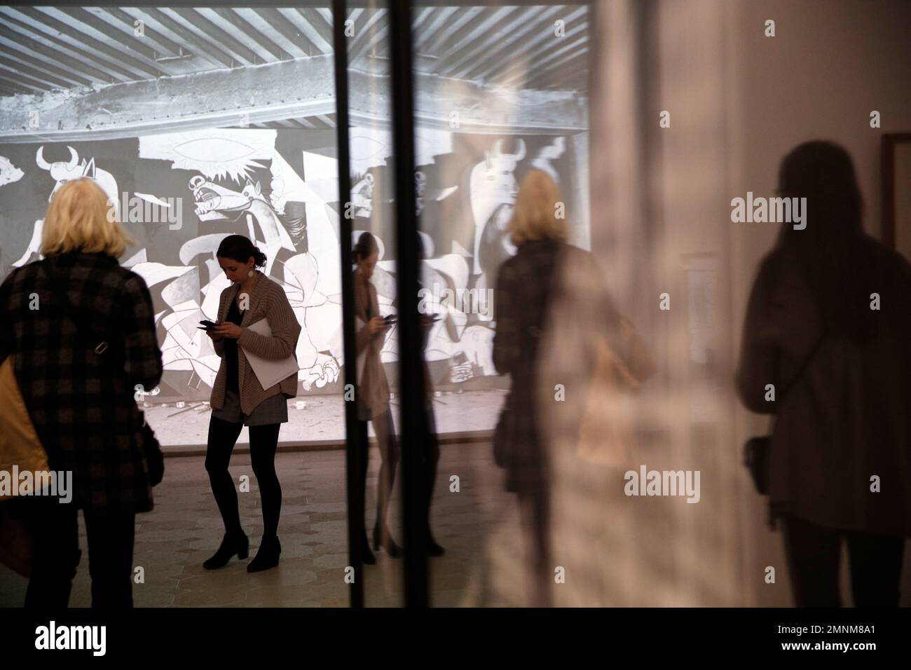 Visitors are reflected on "Guernica Redacted (After Picasso's Guernica ...