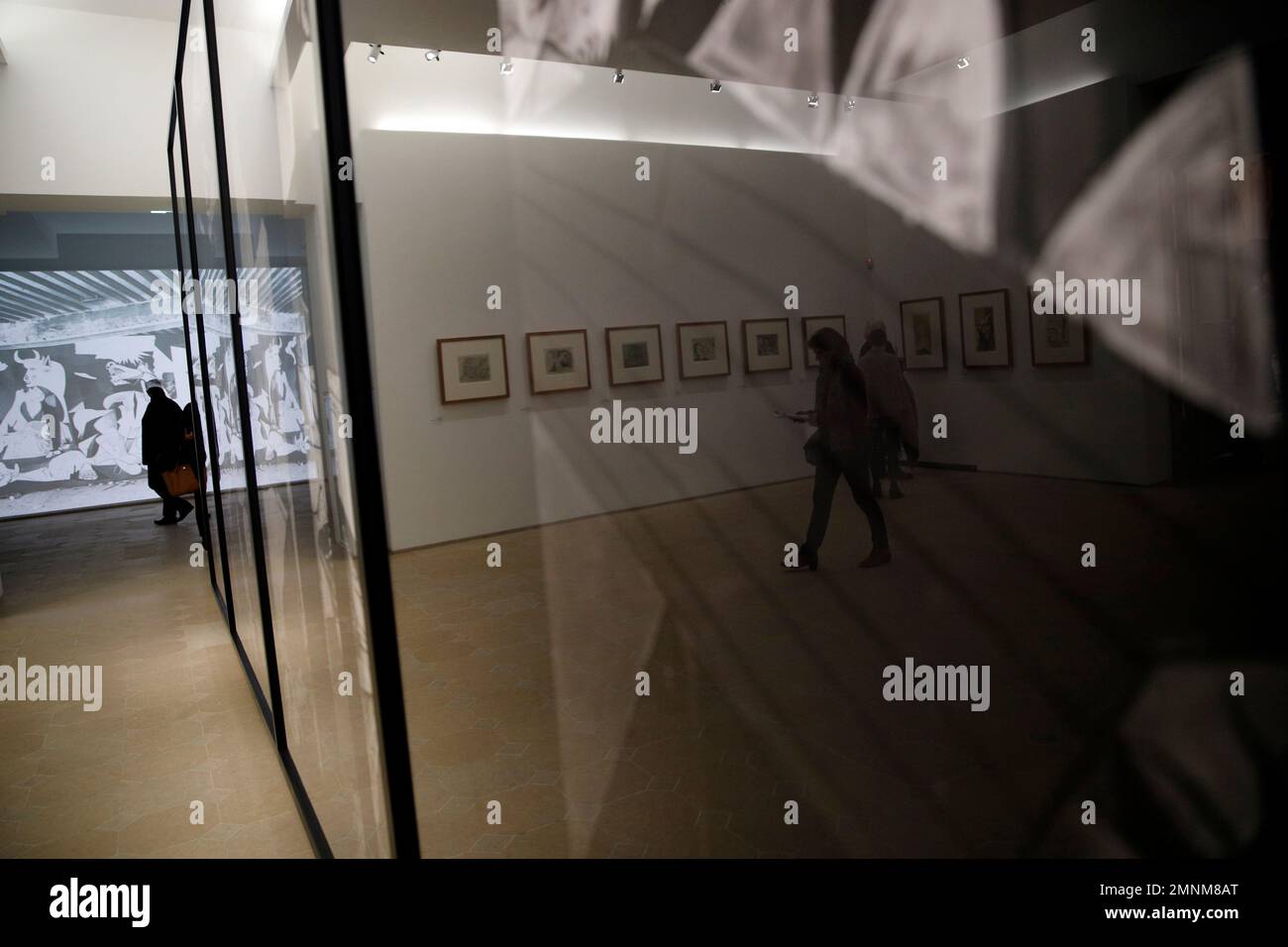 Visitors are reflected on "Guernica Redacted (After Picasso's Guernica ...