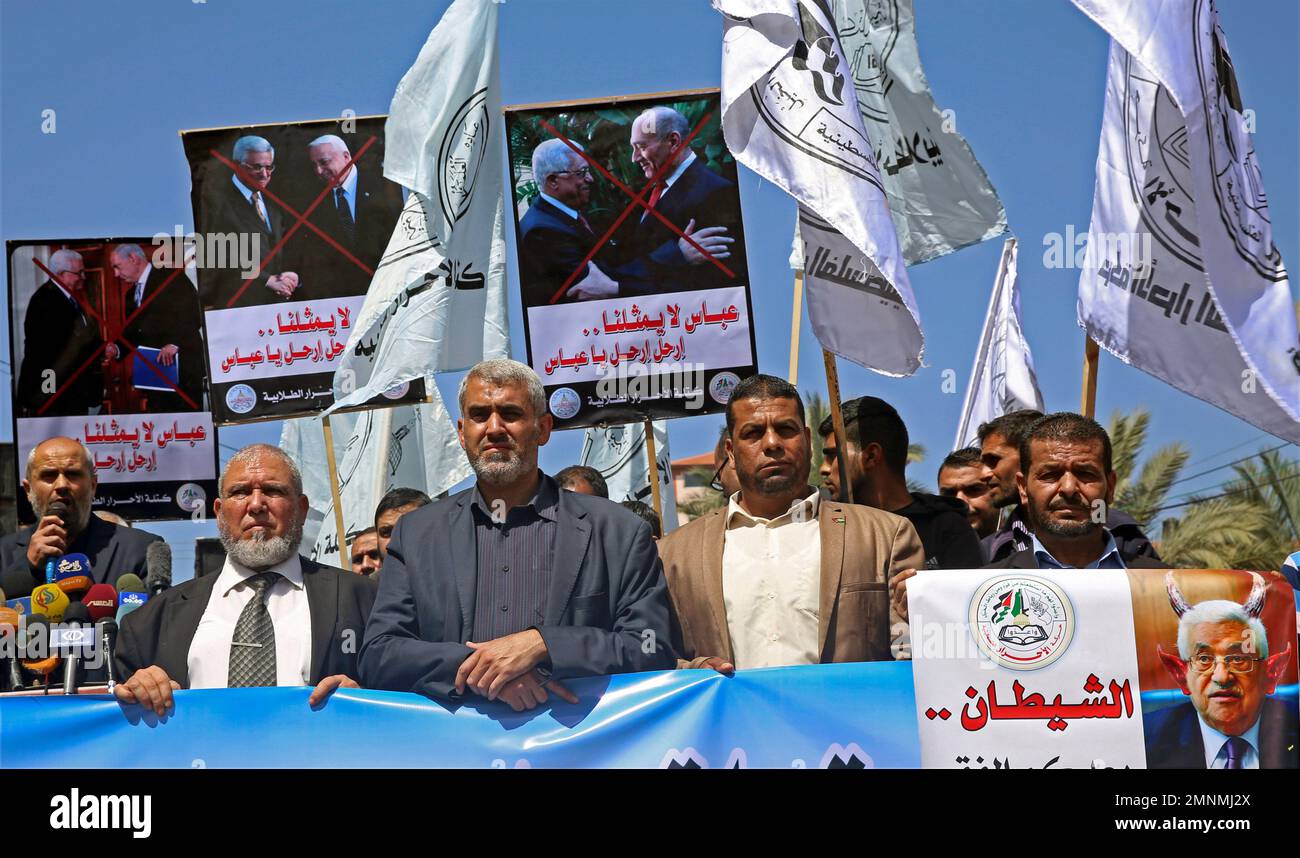 Pro-Hamas protesters hold pictures of Palestinian President Mahmoud ...