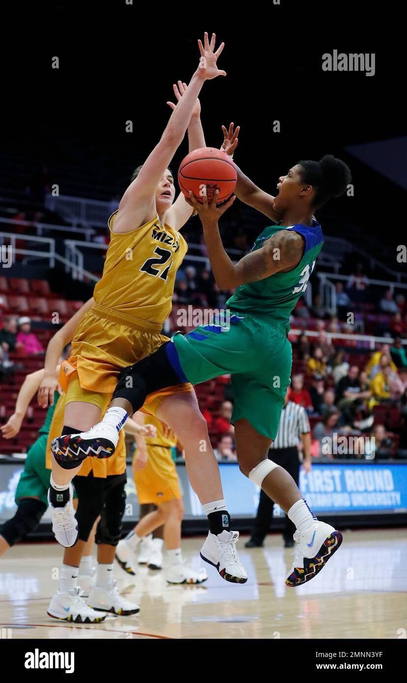 Florida Gulf Coast forward Rosemarie Julien, right, drives to the ...