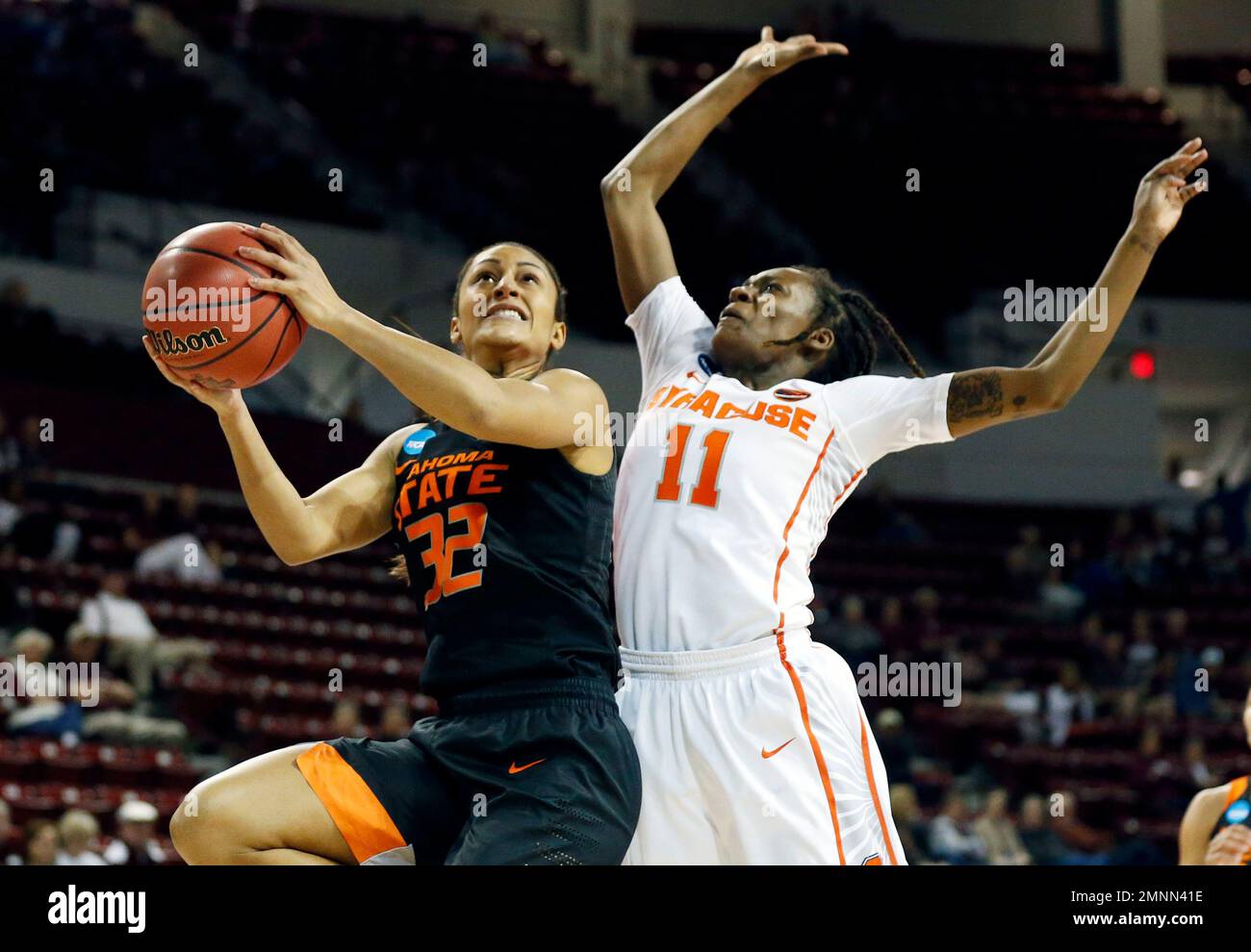 Oklahoma State guard Loryn Goodwin (32) attempts a layup past Syracuse ...