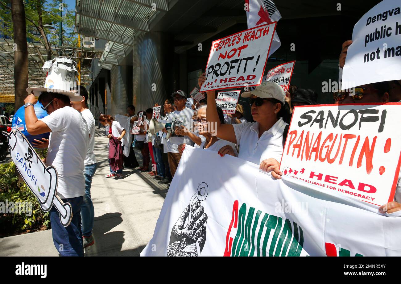 Protesters display placards and shout slogans as they picket the Sanofi ...