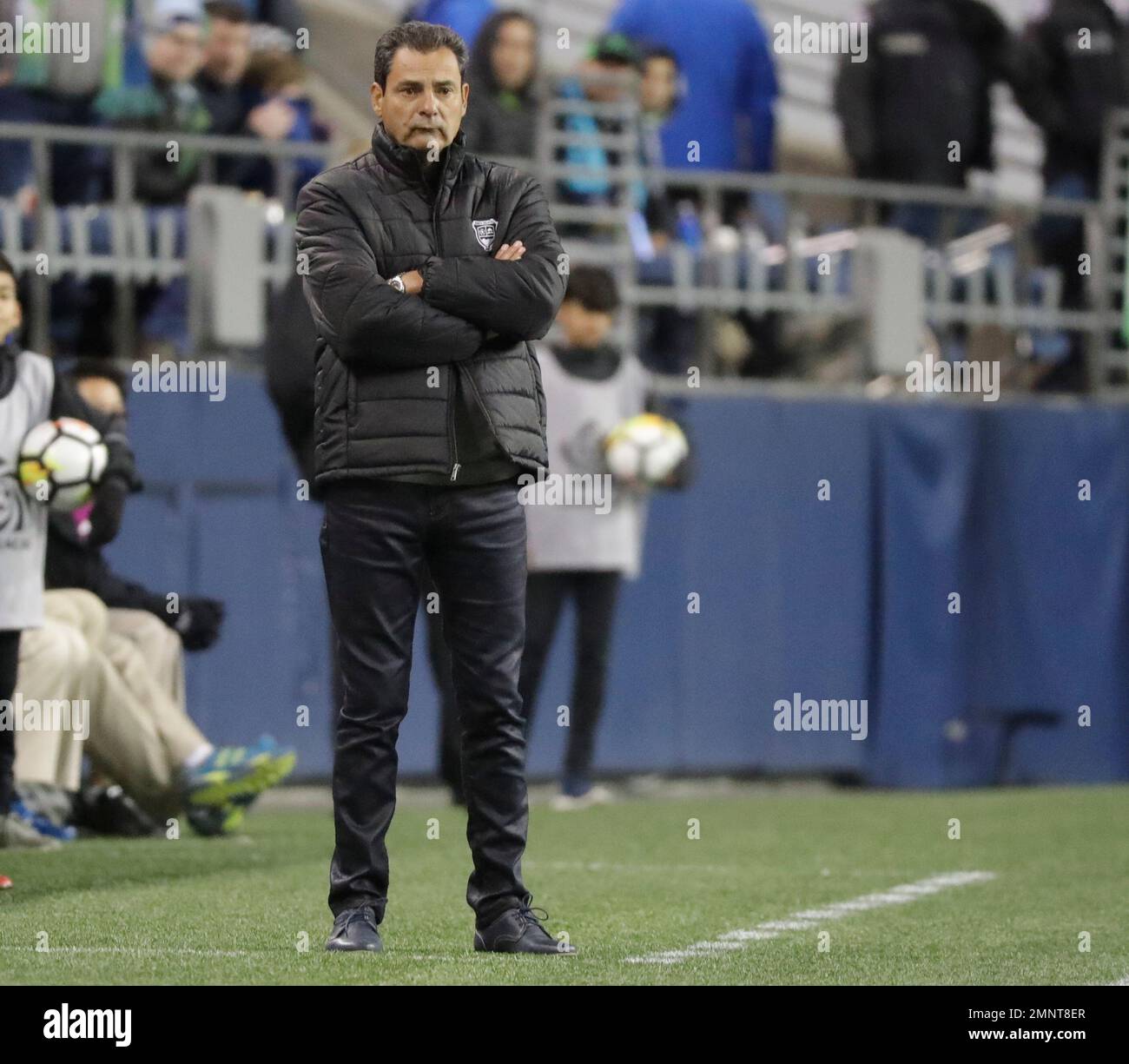 Santa Tecla head coach Ruben Da Silva stands near the bench during the ...