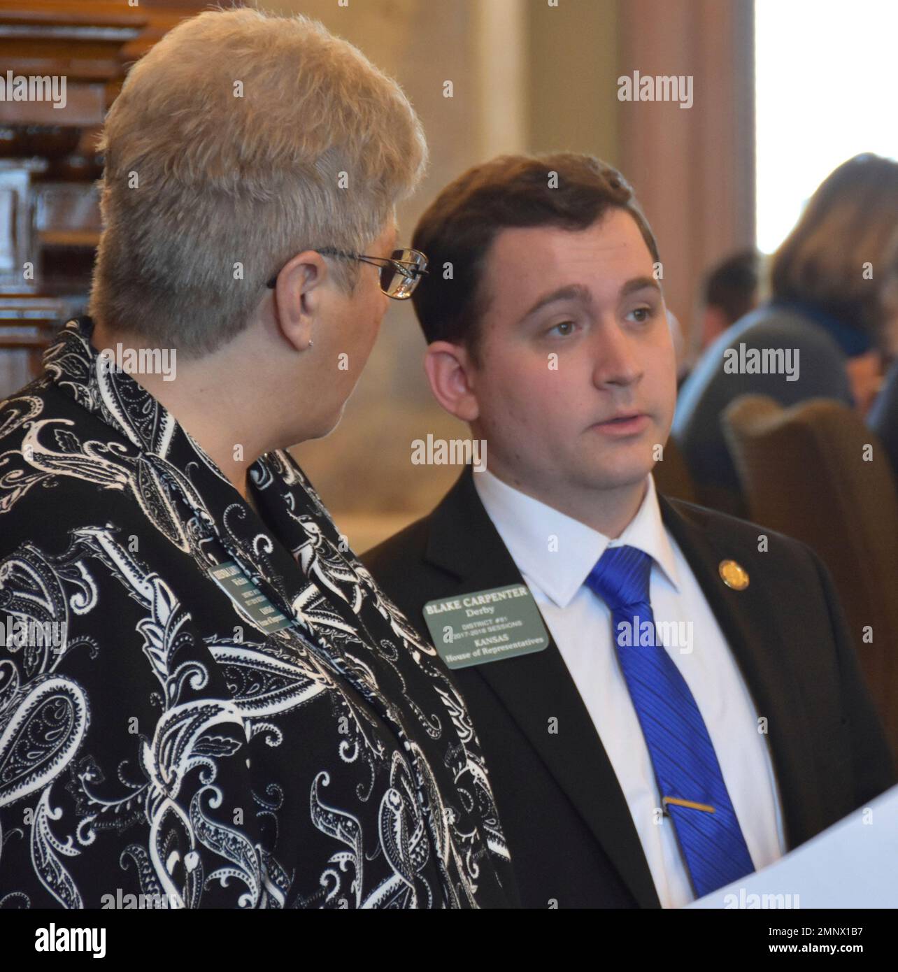 Kansas state Rep. Blake Carpenter, right, R-Derby, confers with Rep ...