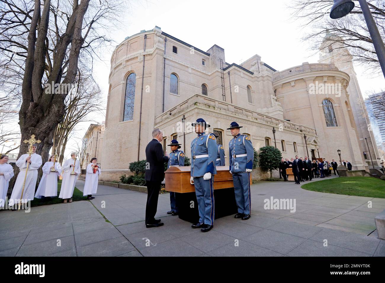 A Washington State Patrol honor guard moves the casket of former Gov ...