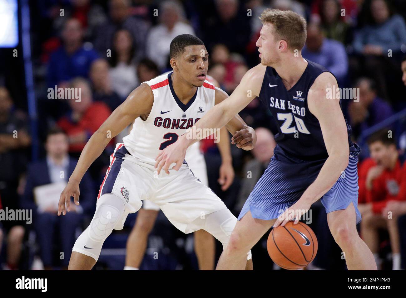 San Diego forward Cameron Neubauer (20) dribbles the ball while ...