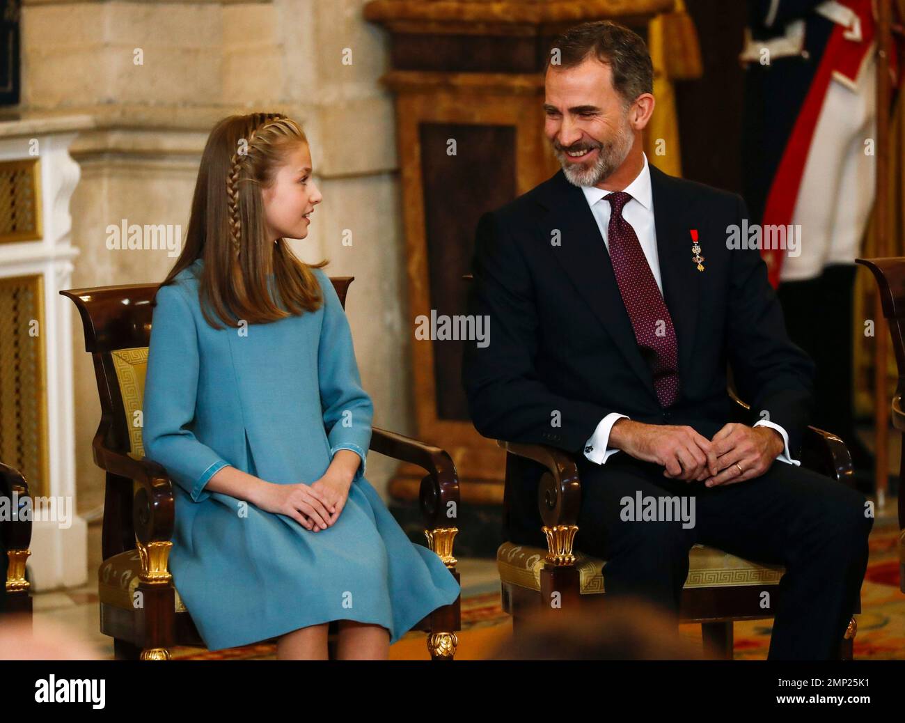 Spain's King Felipe sits next to his daughter Princess Leonor during a ...