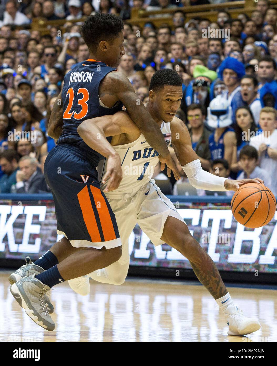 Duke's Trevon Duval (1) drives against Virginia's Nigel Johnson (23 ...