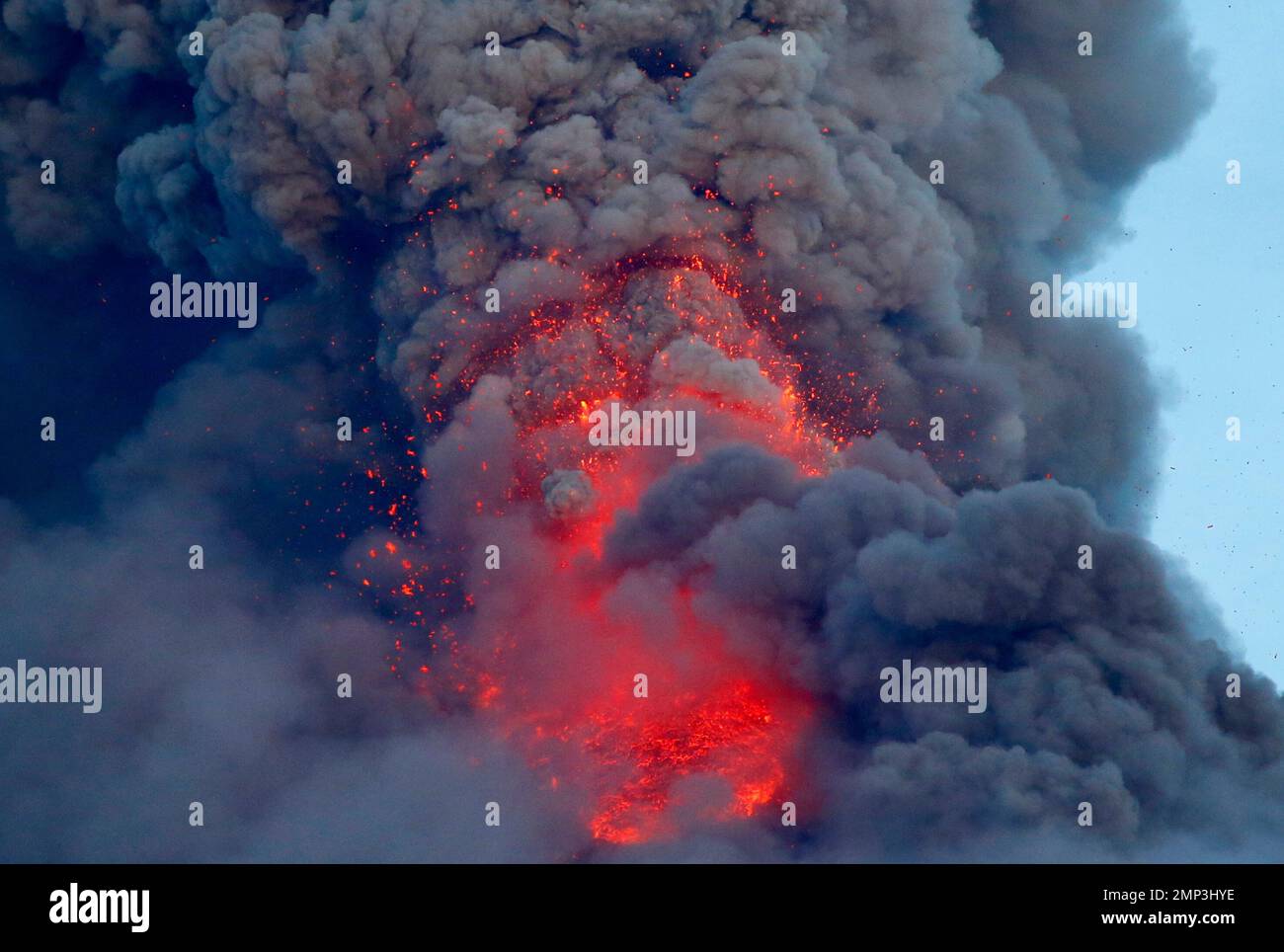 Mayon volcano spews molten lava during its sporadic eruption early ...