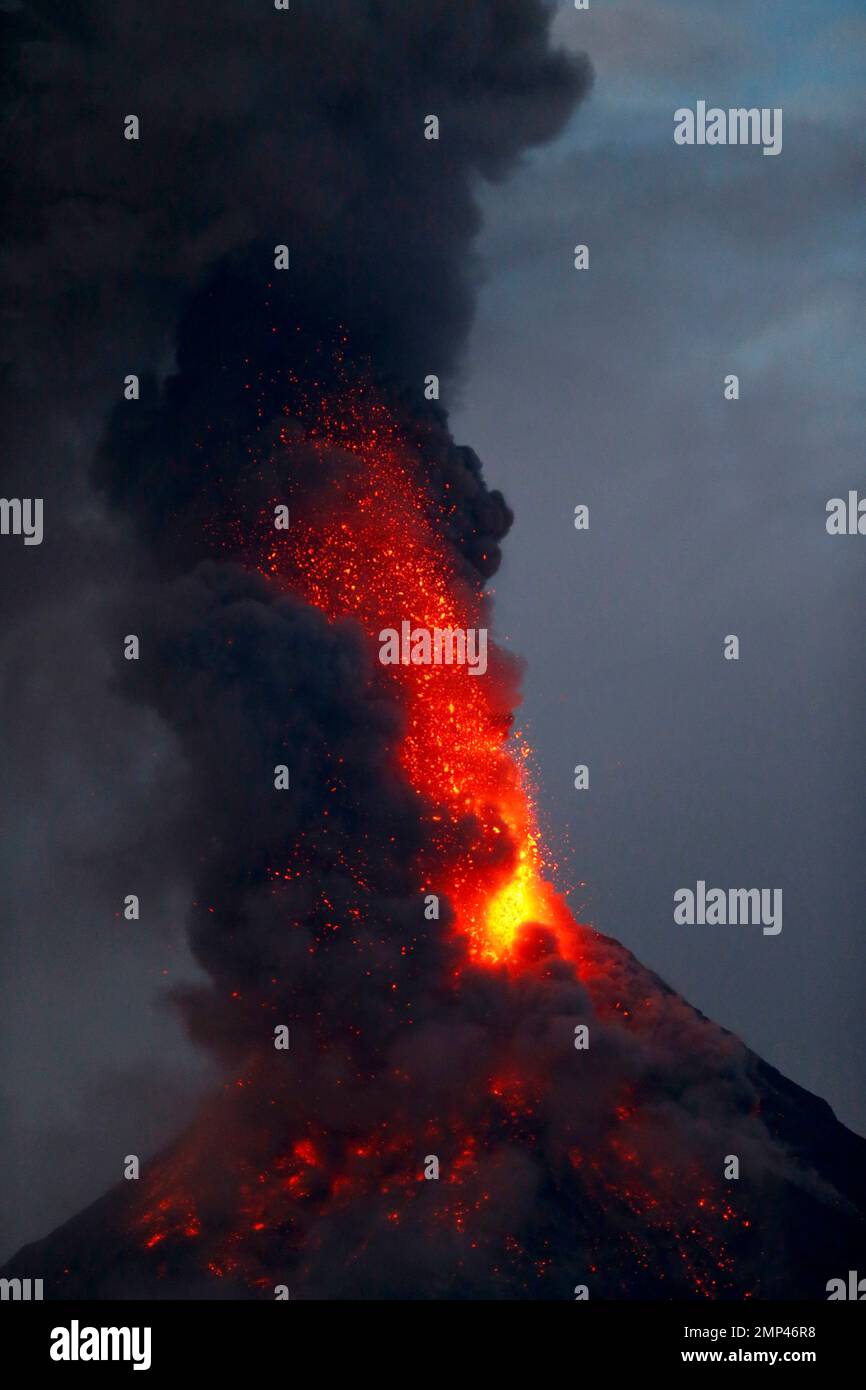 Mayon volcano spews red-hot lava in another eruption as seen from Legazpi city, Albay province ...