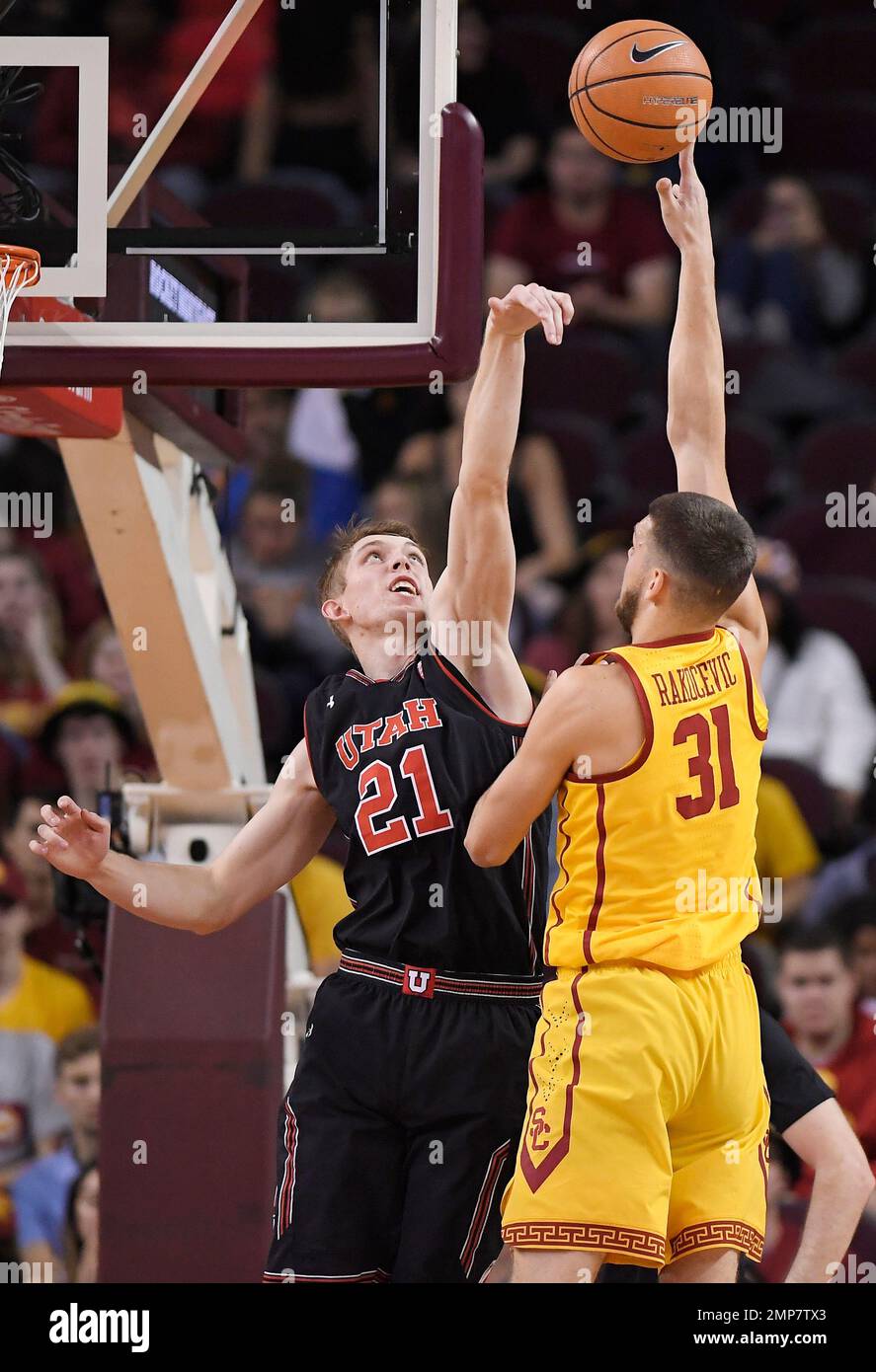 Southern California forward Nick Rakocevic, right, shoots as Utah ...