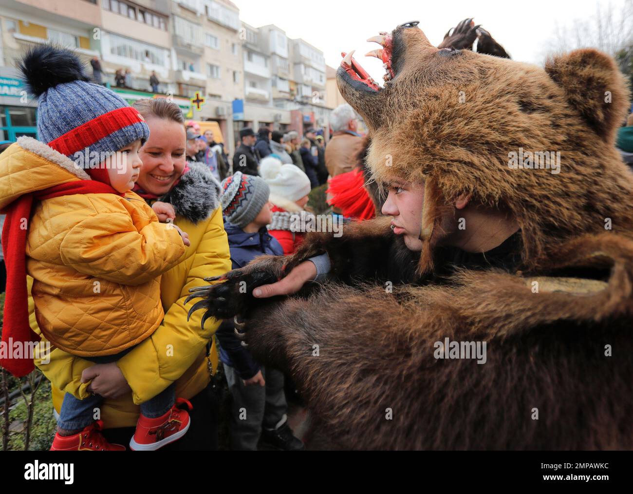In this Saturday, Dec. 30, 2017, picture a man wearing a bear fur ...