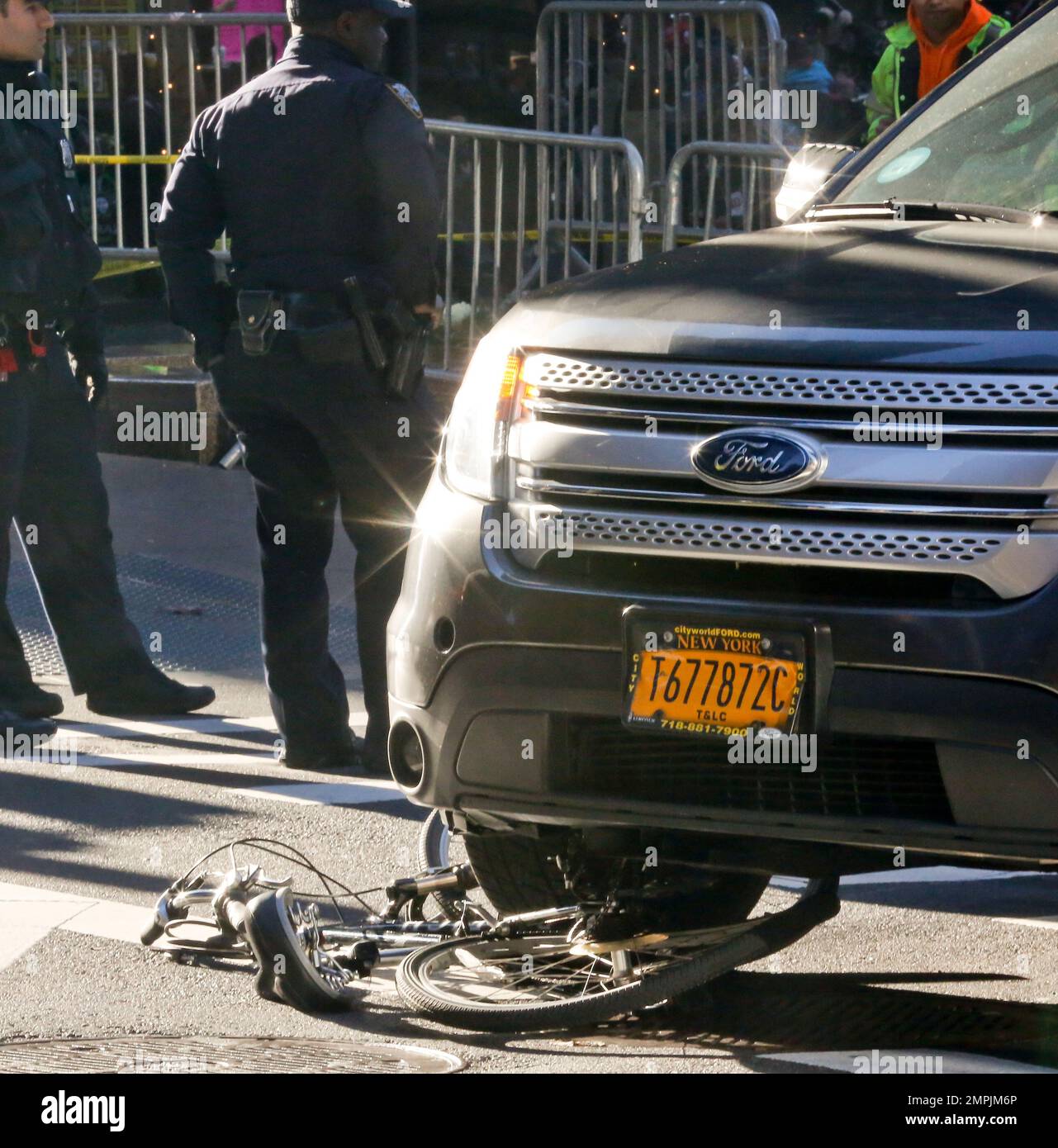 NYPD officers investigate the scene of a crash, Thursday Dec. 7, 2017 ...