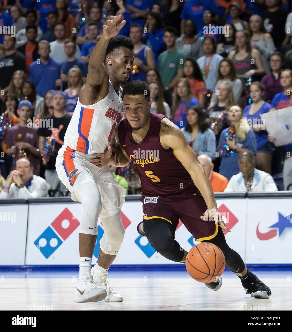 Loyola of Chicago guard Marques Townes (5) drives past Florida guard ...