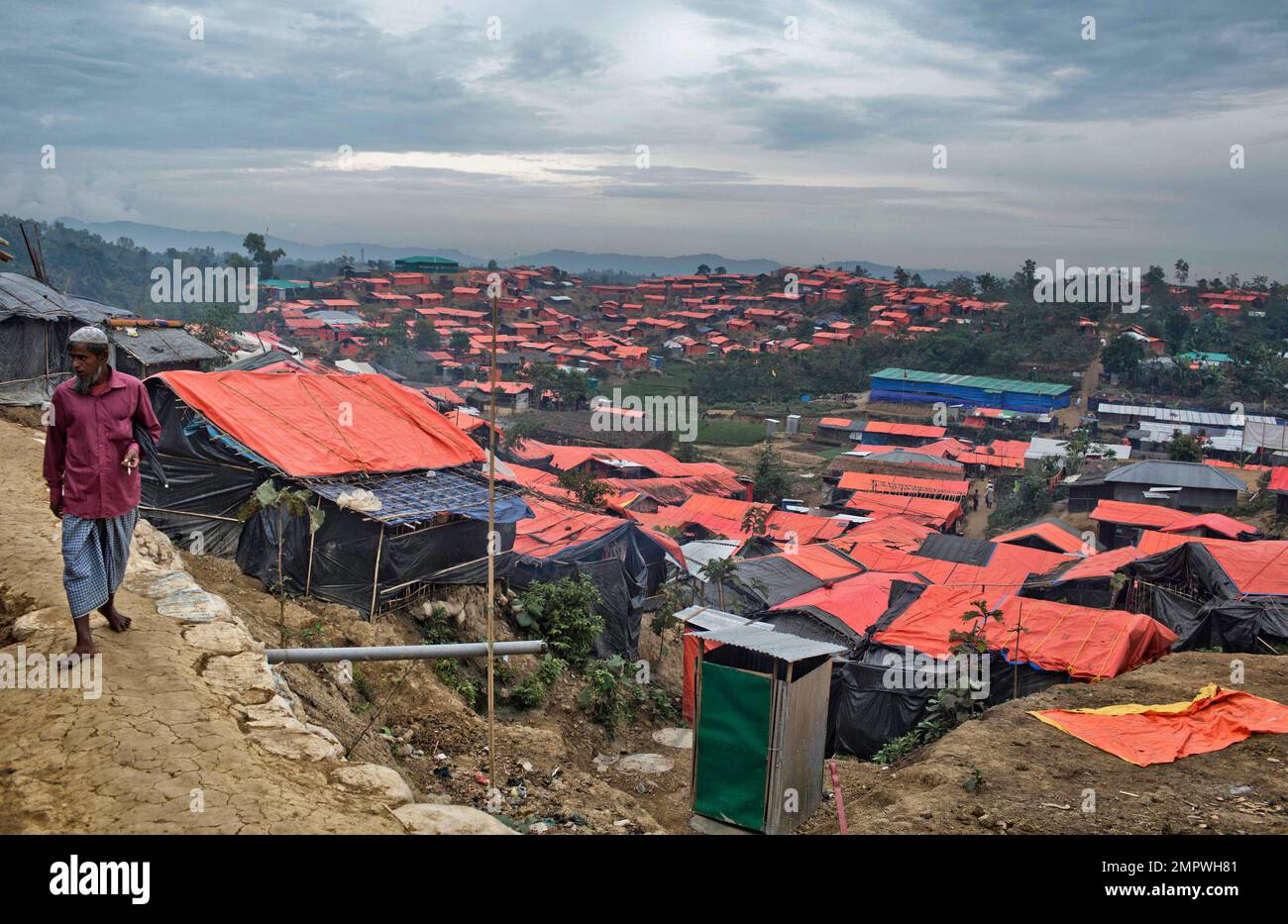 A Rohingya Muslim, who crossed over from Myanmar into Bangladesh, walks at Jamtoli refugee camp ...