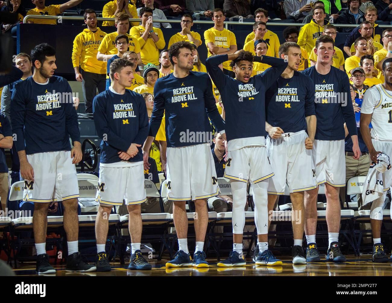 Michigan guard Jordan Poole, third from right, react with his fellow ...