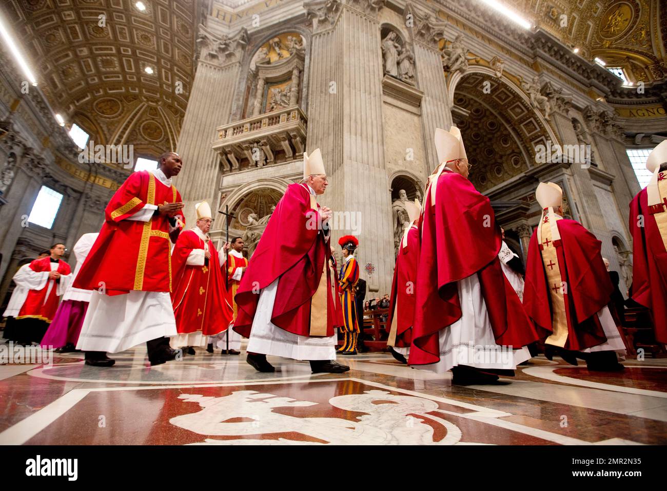 Pope Francis, third from left, arrives in St. Peter's Basilica at the ...