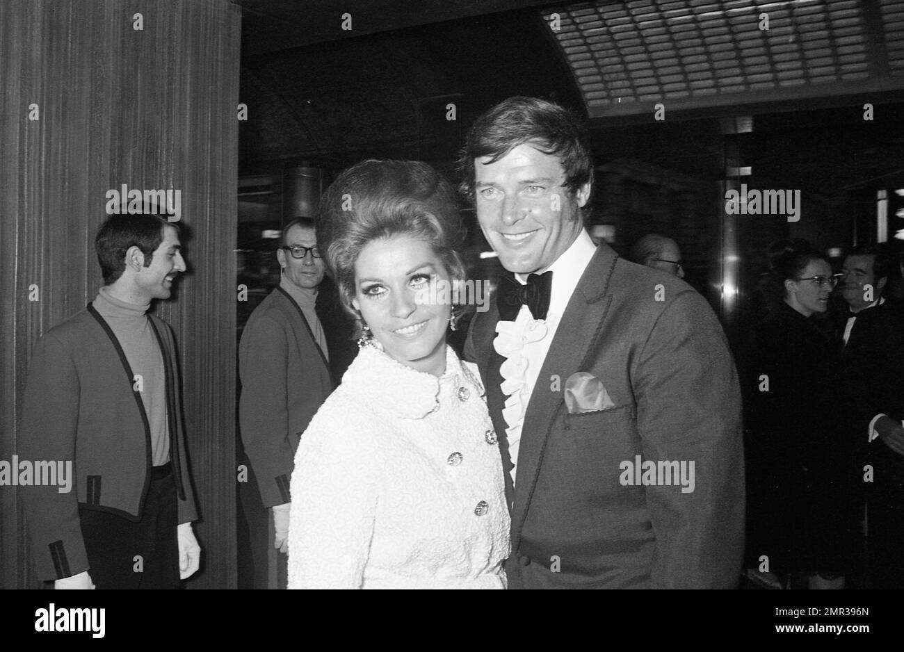British actor Roger Moore and Italian actress Luisa Mattioli arrive at ...