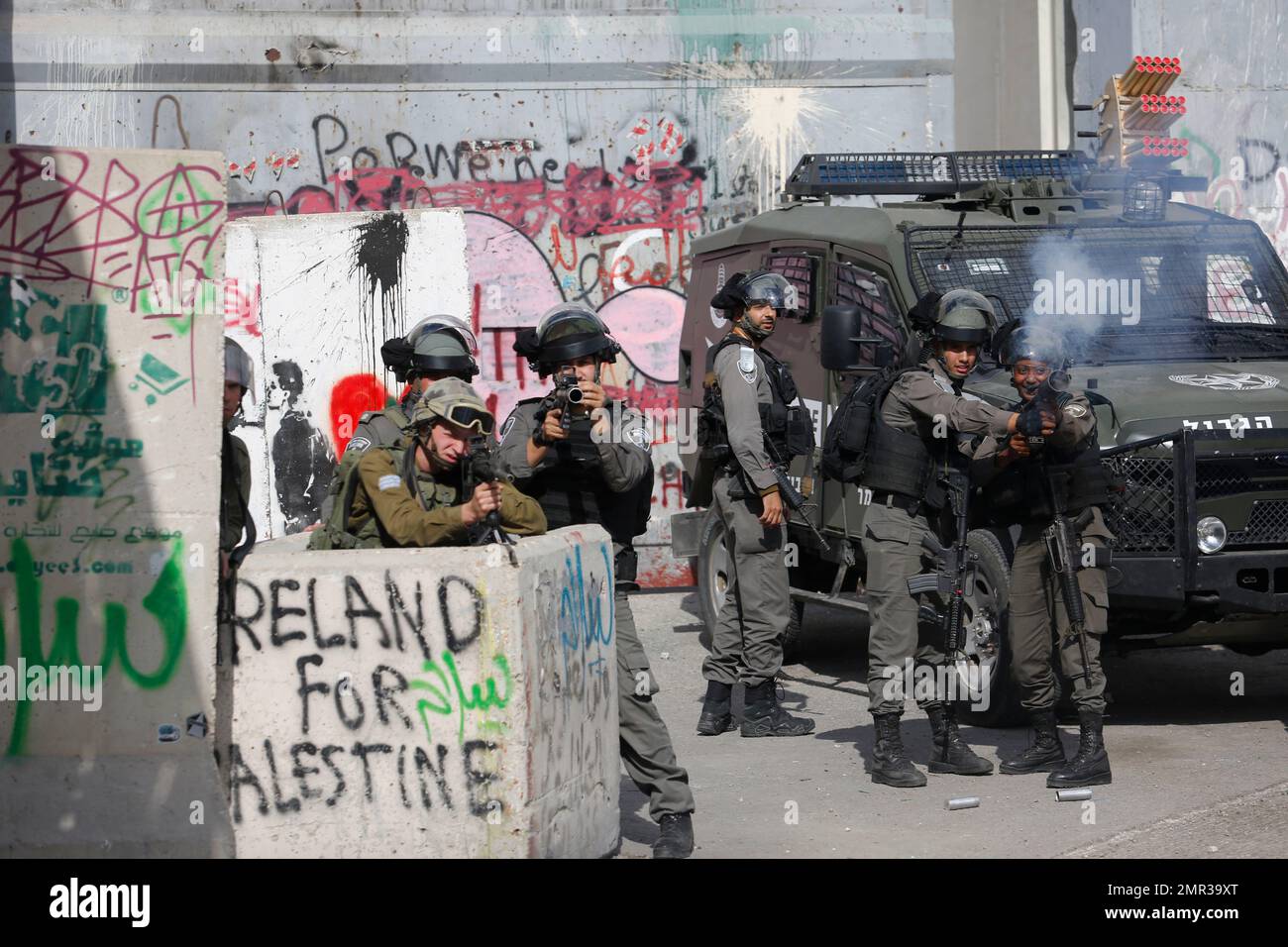 Israeli security fires tear gas during a protest on the anniversary of ...