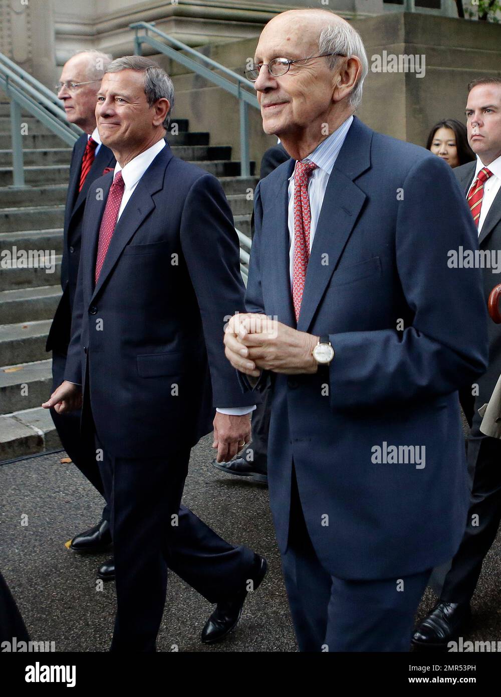 Associate Supreme Court Justices Anthony Kennedy, left rear, and ...