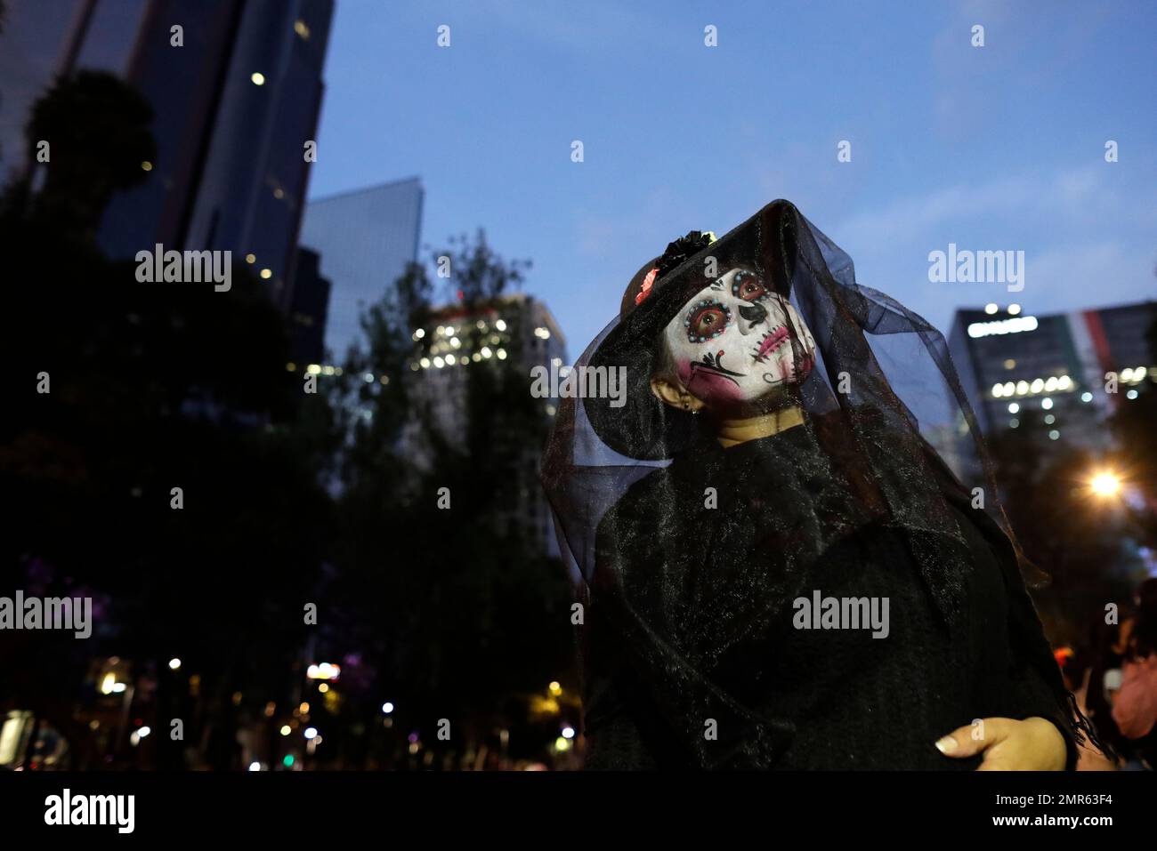 A woman dressed as Mexico's iconic "Catrina" poses for a picture during ...