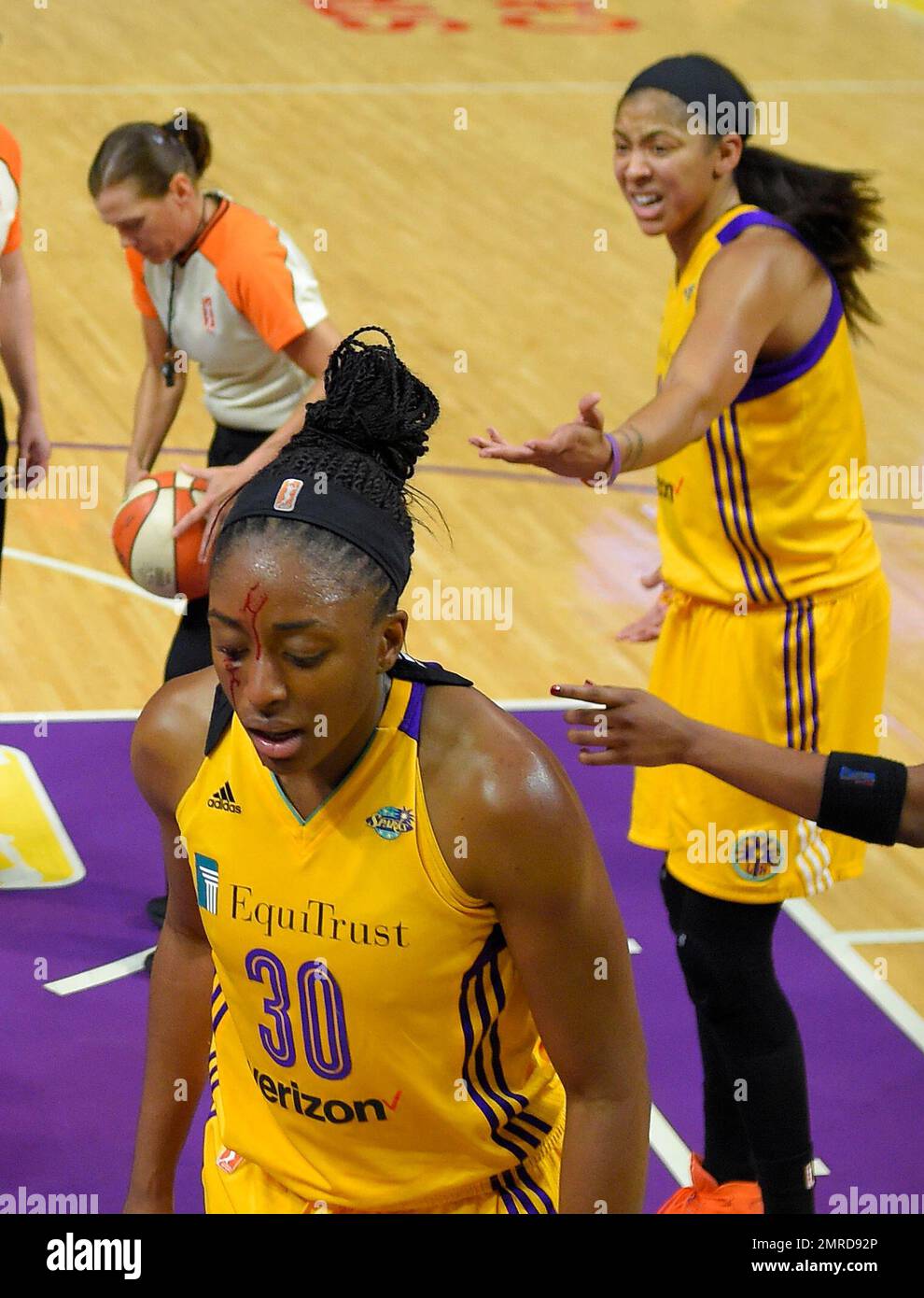 Los Angeles Sparks forward Nneka Ogwumike, front, walks off the court ...