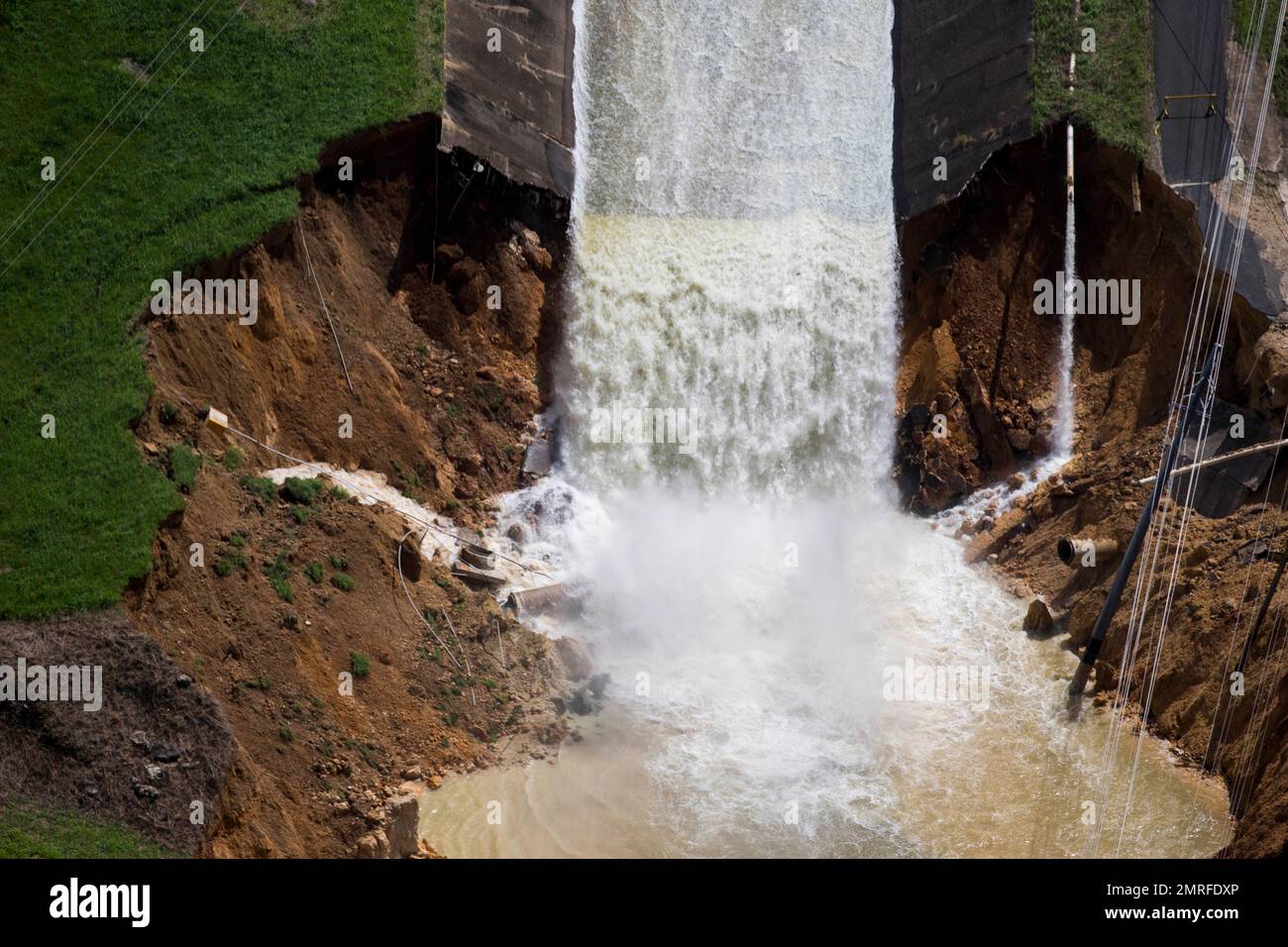 Water drains from the Guajataca Dam in Quebradillas, Puerto Rico ...
