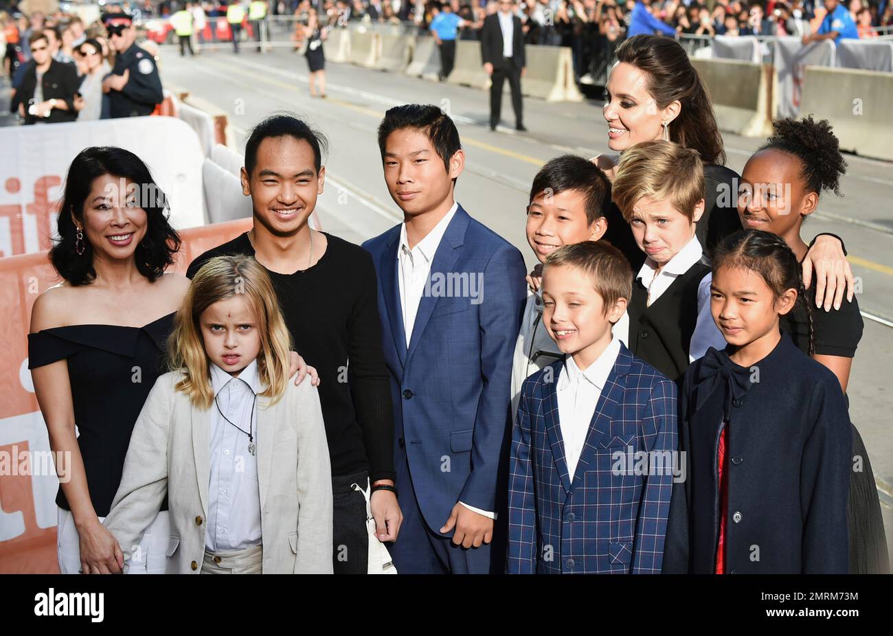 Vivienne Jolie-Pitt, from front row left, Knox Jolie-Pitt, Sareum Srey ...