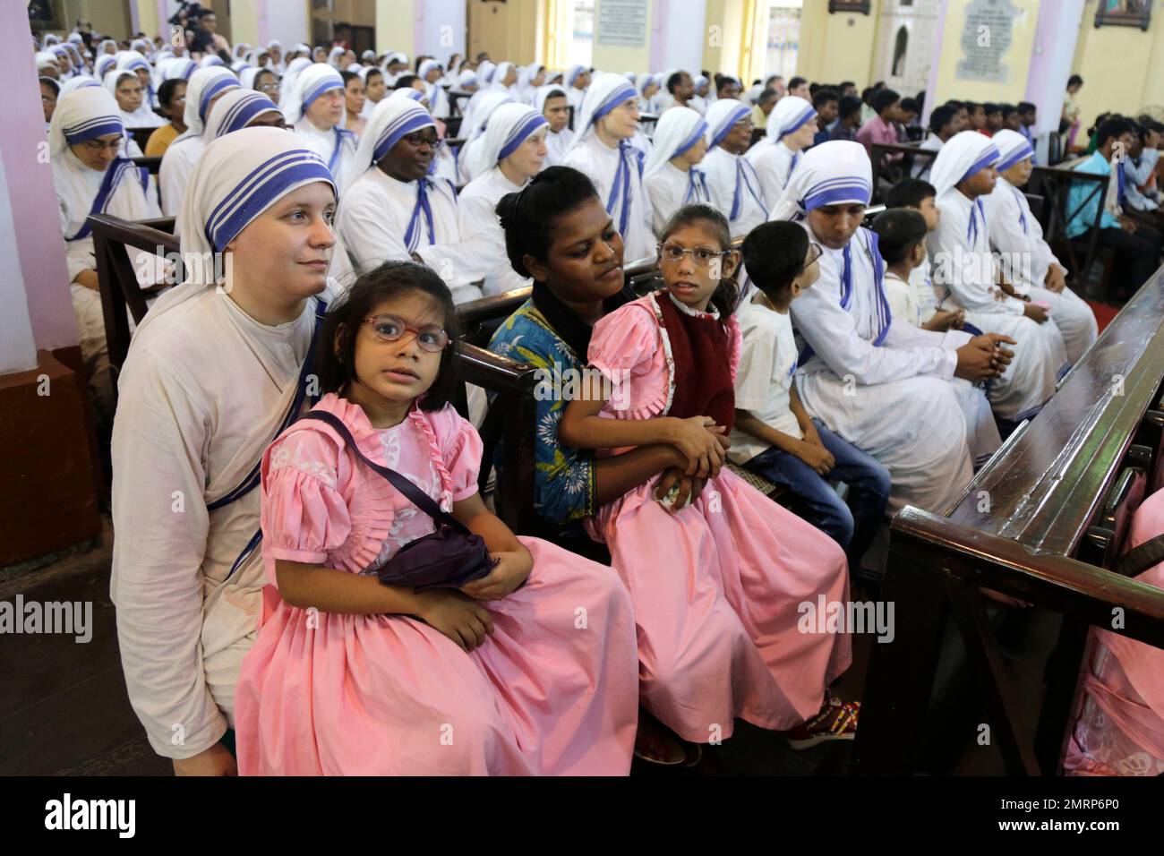 Nuns of Missionaries of Charity, the order founded by Saint Teresa, sit ...