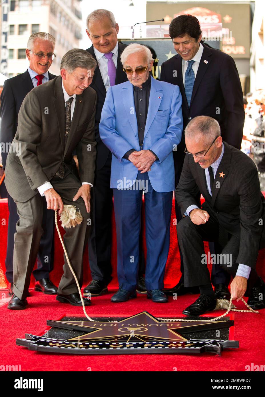 Singer and songwriter Charles Aznavour, center, is honored with a star ...