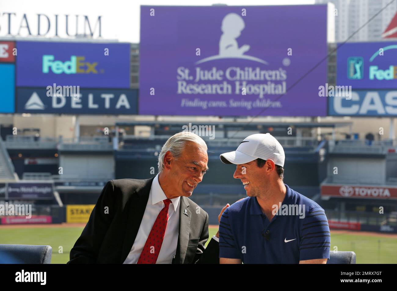 Golfer Rory McIlroy, right, speaks to ALSAC CEO Richard Shadyac Jr ...