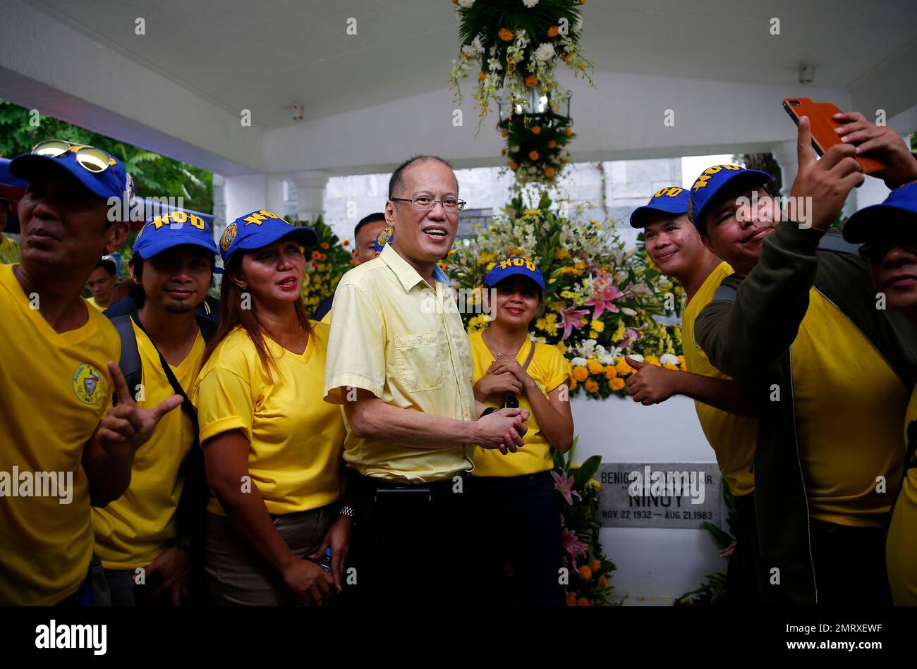 Former Philippine President Benigno Aquino III poses with supporters ...