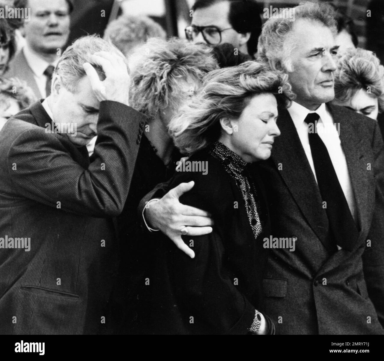 Mr. Derek Wood, father of Corporal Derek Wood, with arm around his ...