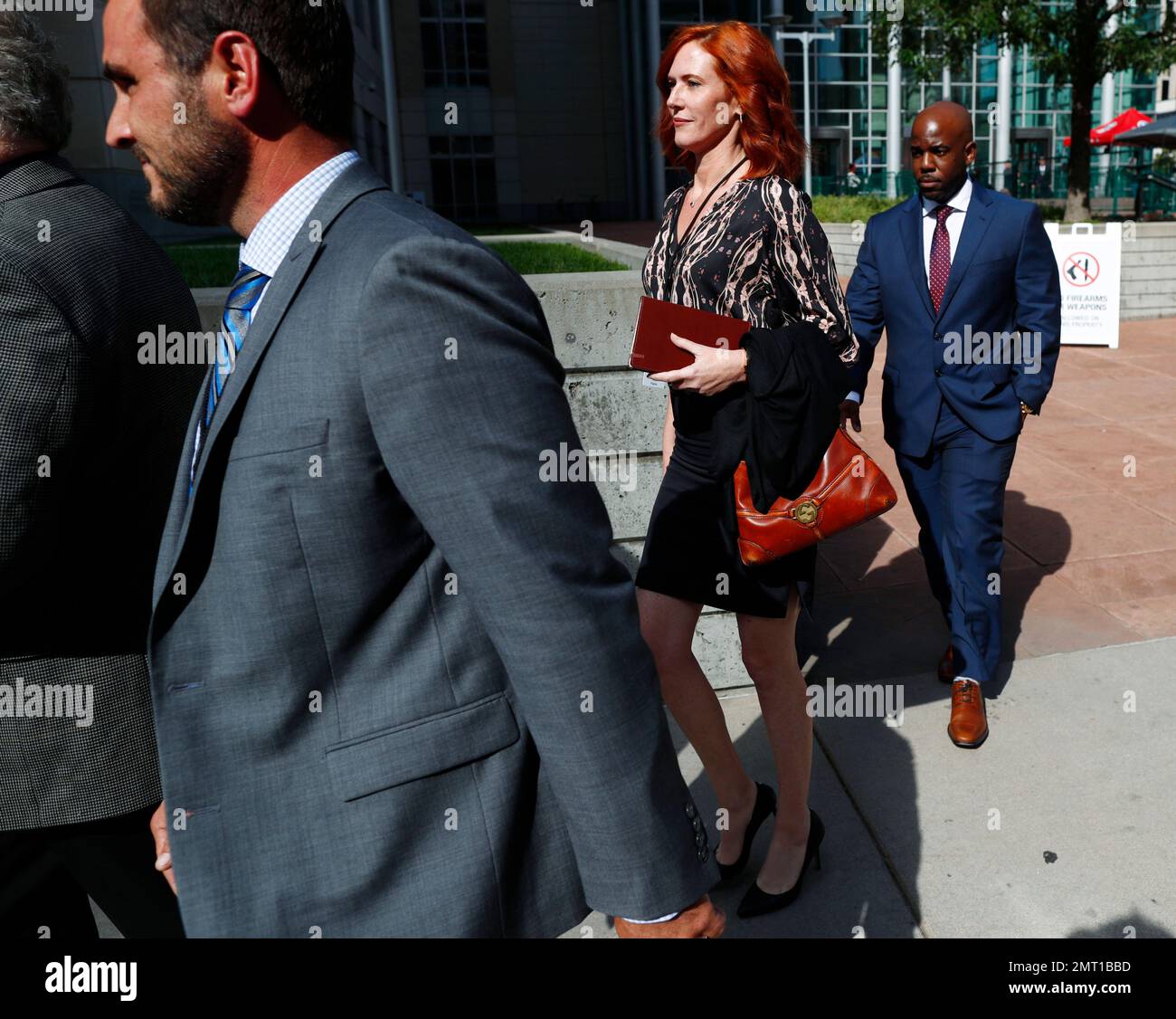 Tree Paine, center, publicist for pop singer Taylor Swift, leaves the ...