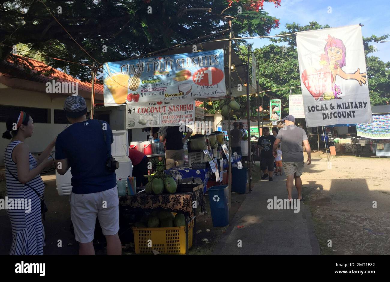 People walk through the Chamorro Village marketplace in Hagatna, Guam ...