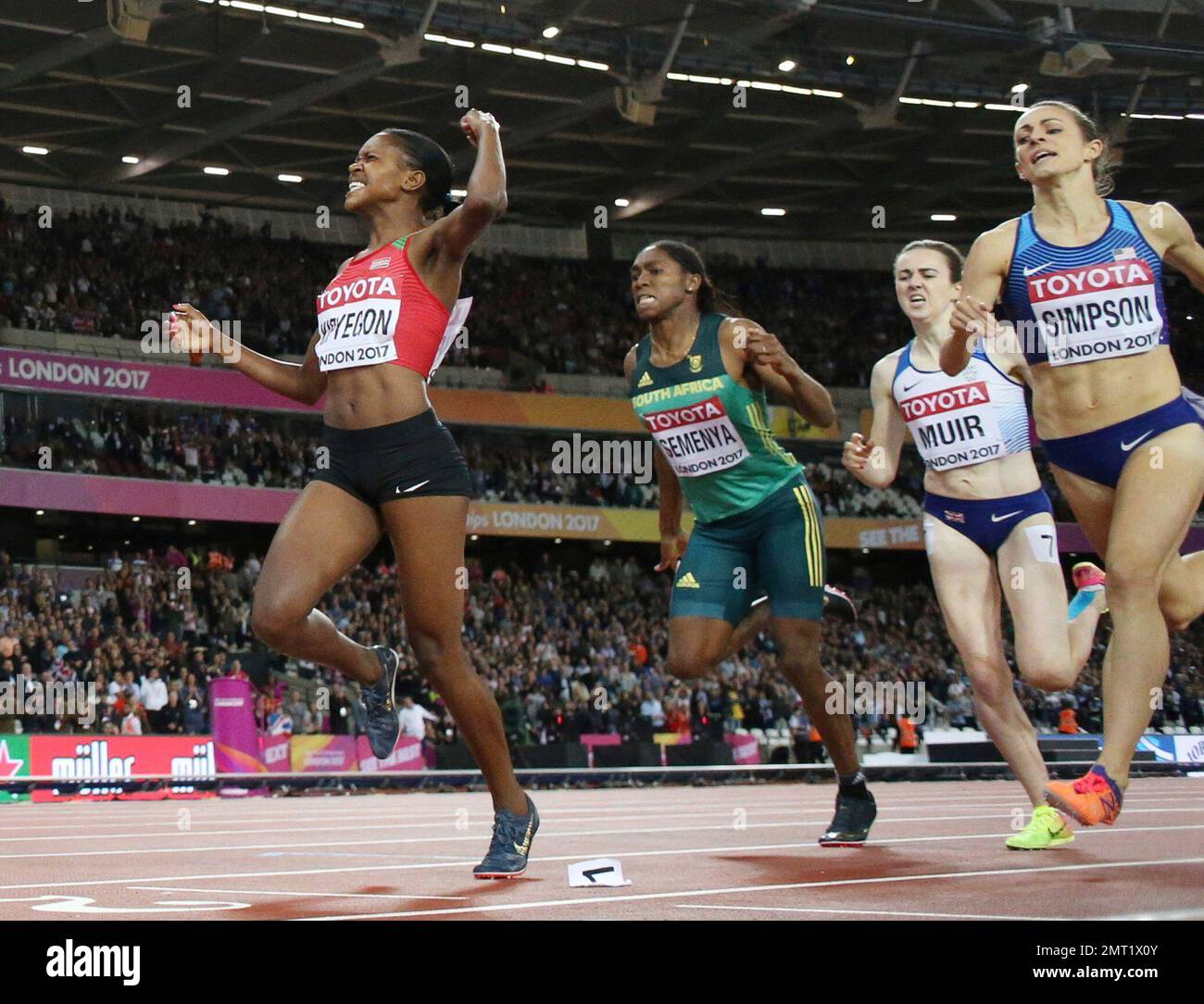 Kenya's Faith Chepngetich Kipyegon, left, celebrates after winning the ...