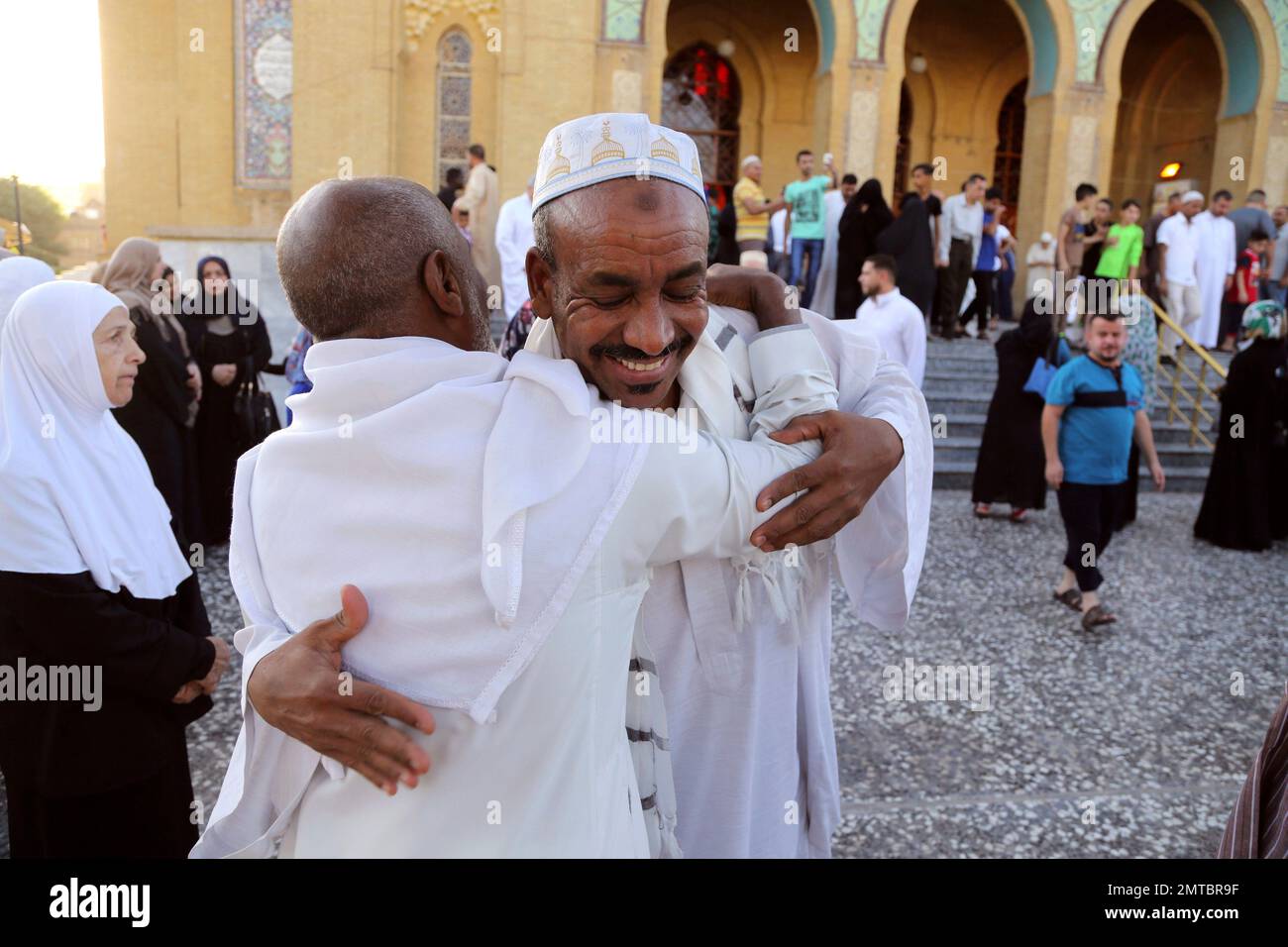Iraqi Sunni Muslims exchange greetings on the first day of Eid al-Fitr ...