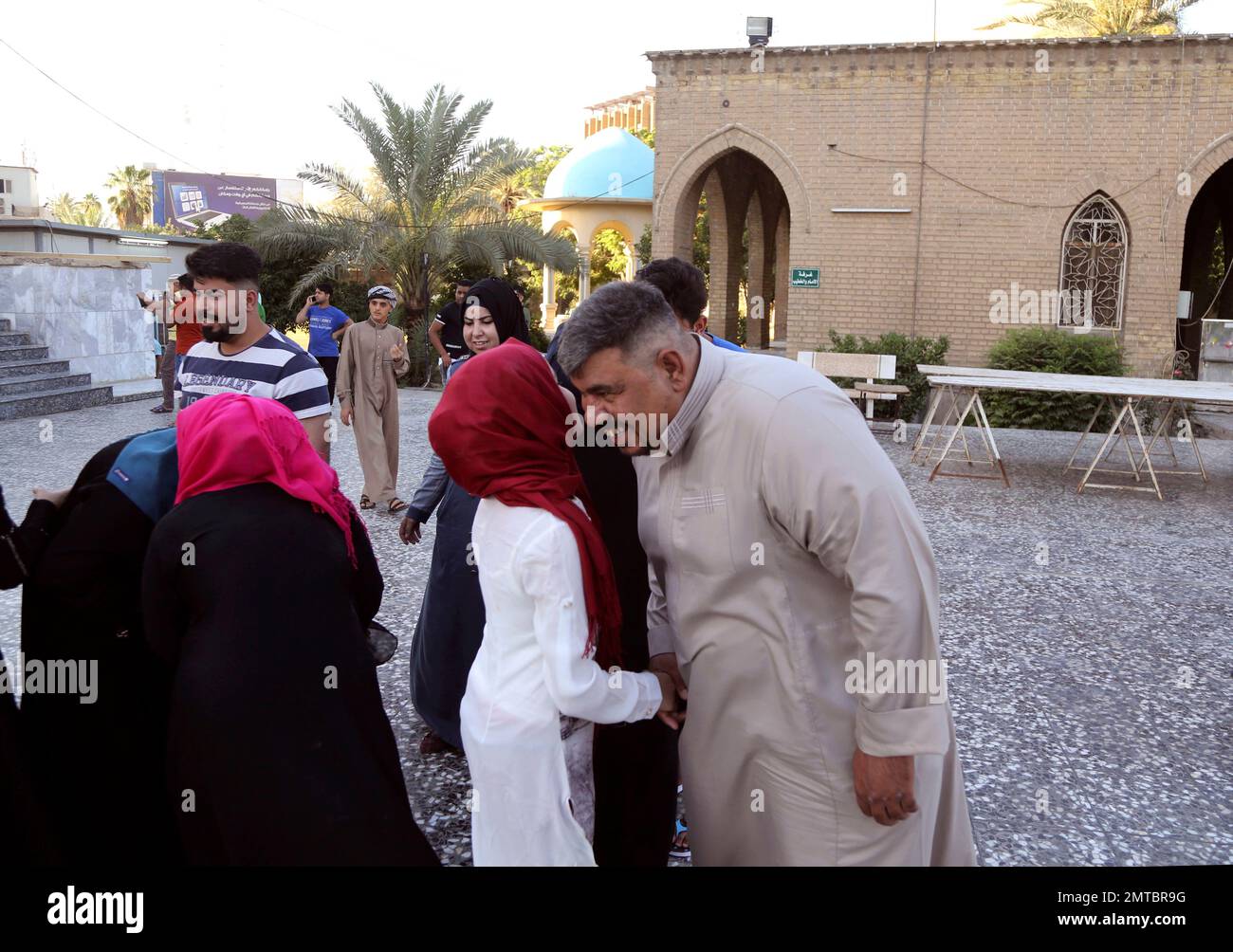 Iraqi Sunni Muslims exchange greetings on the first day of Eid al-Fitr ...