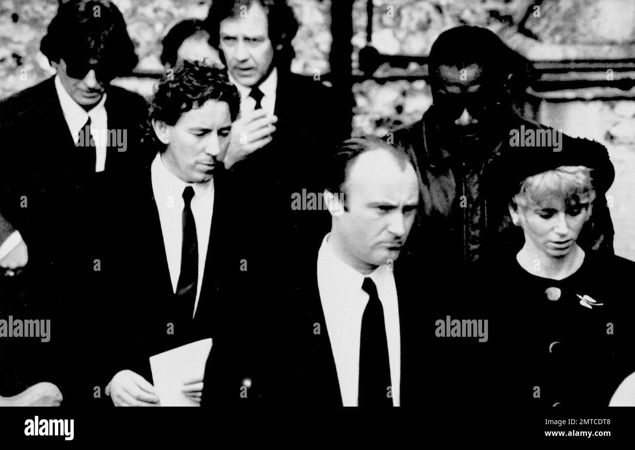 British pop stars Phil Collins, foreground center with wife Jill ...