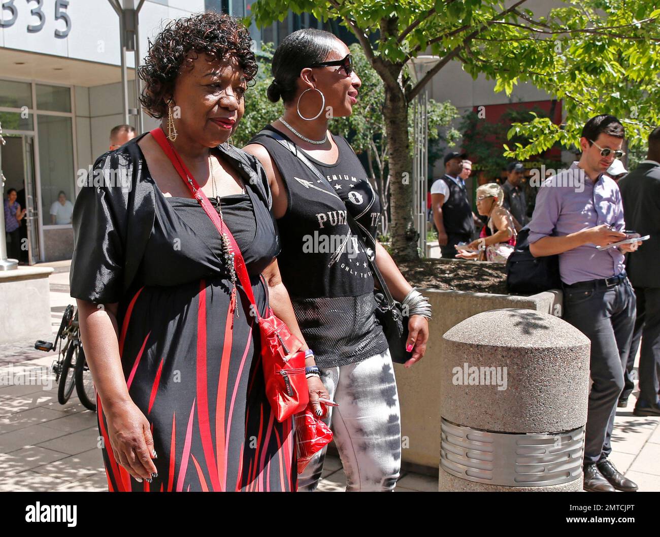 Eric Garner's mother Gwen Carr, left, and sister Ellisha Garner leave a ...